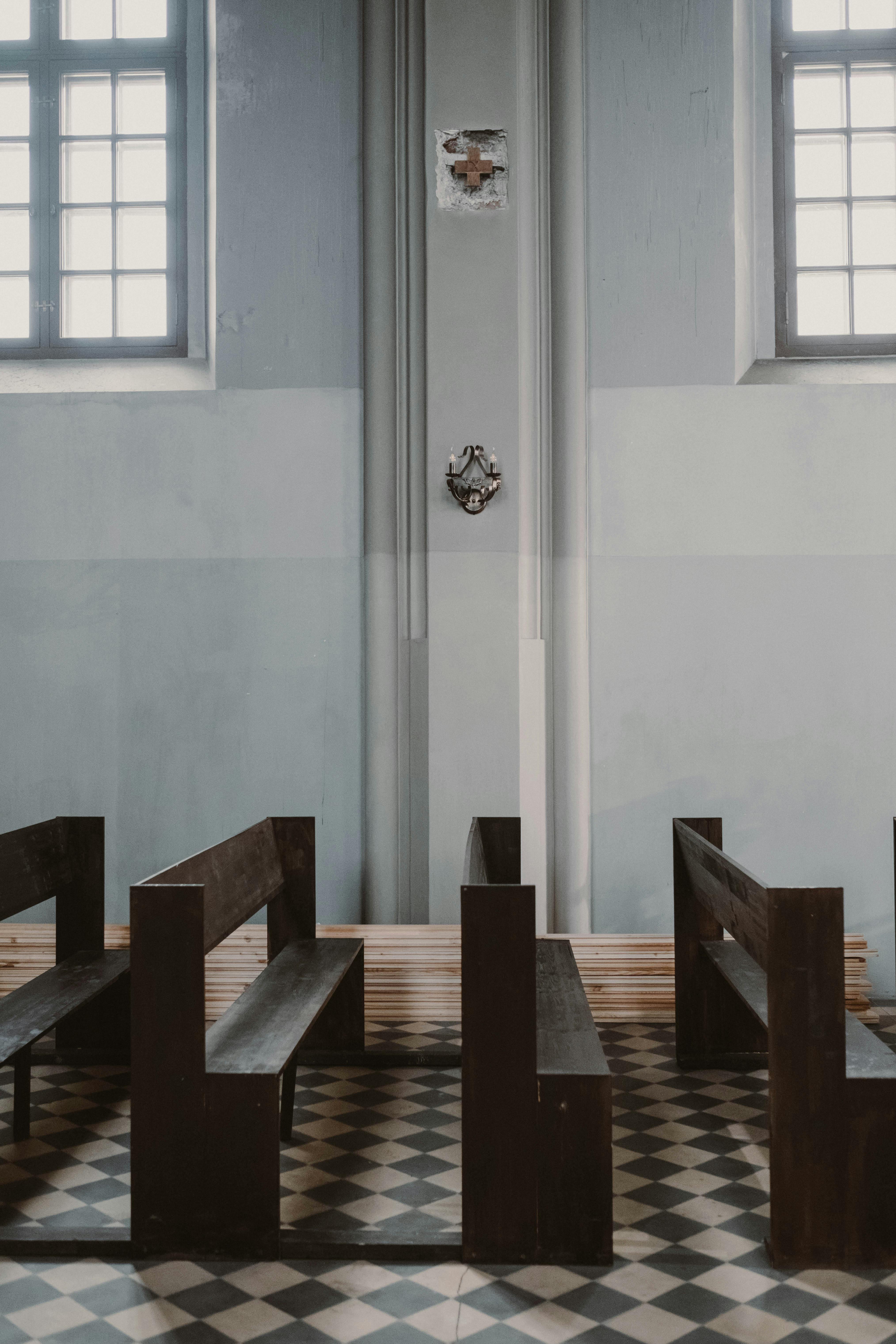 Brown Wooden Church Bench Near White Painted Wall · Free Stock Photo