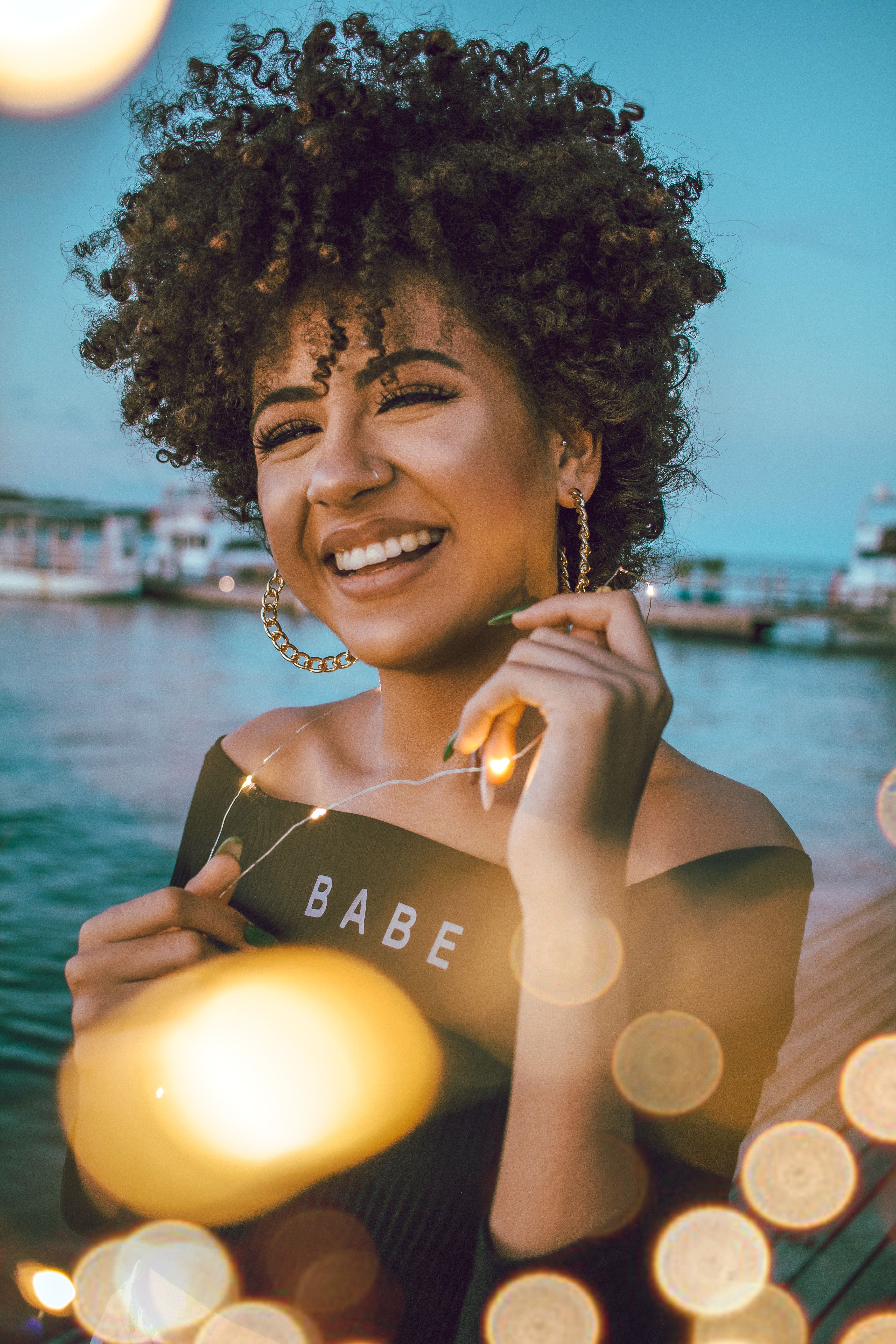 Selective Focus Portrait Photo of Woman Holding Posing · Free Stock Photo