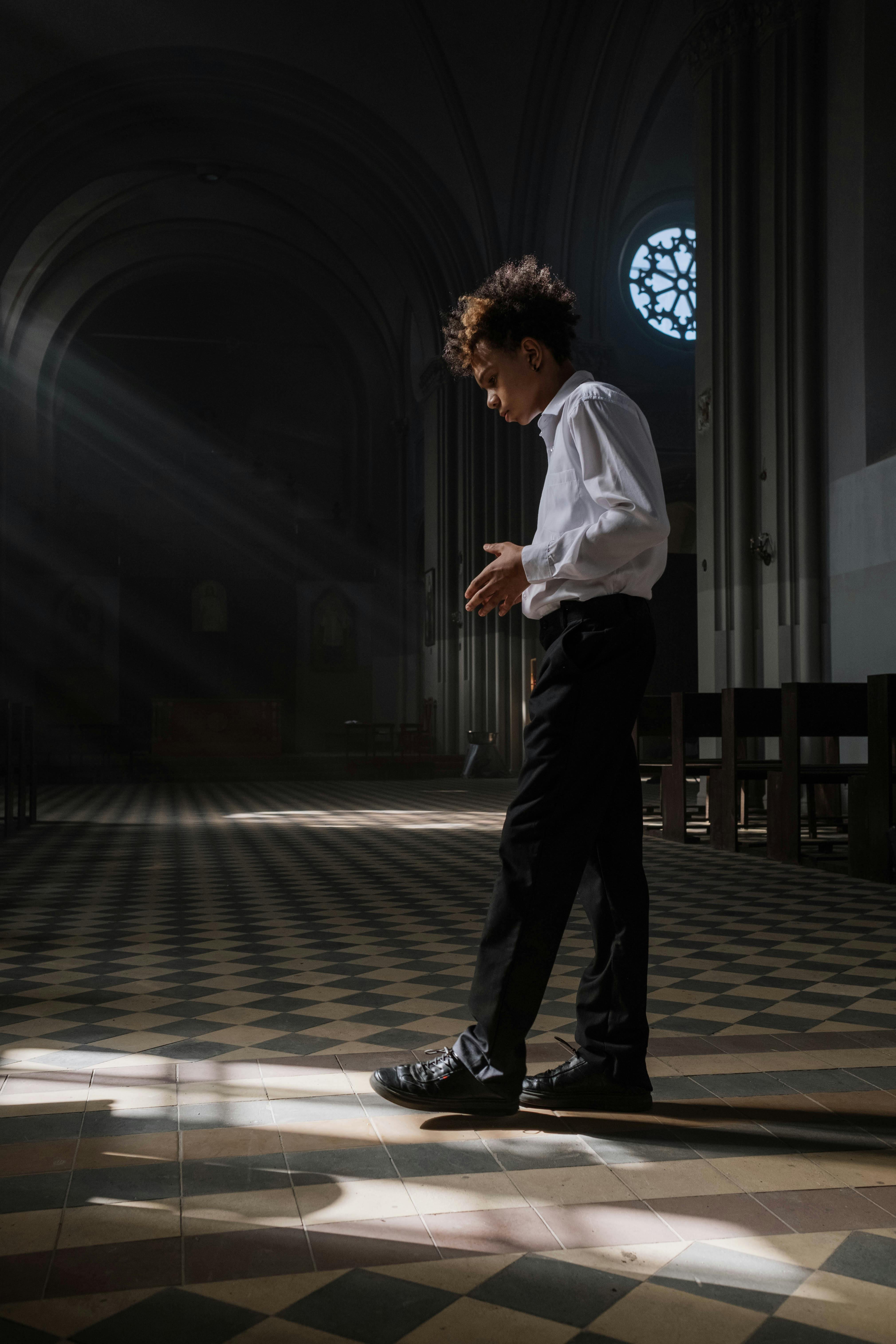 Back View of a Person Standing Inside a Church · Free Stock Photo