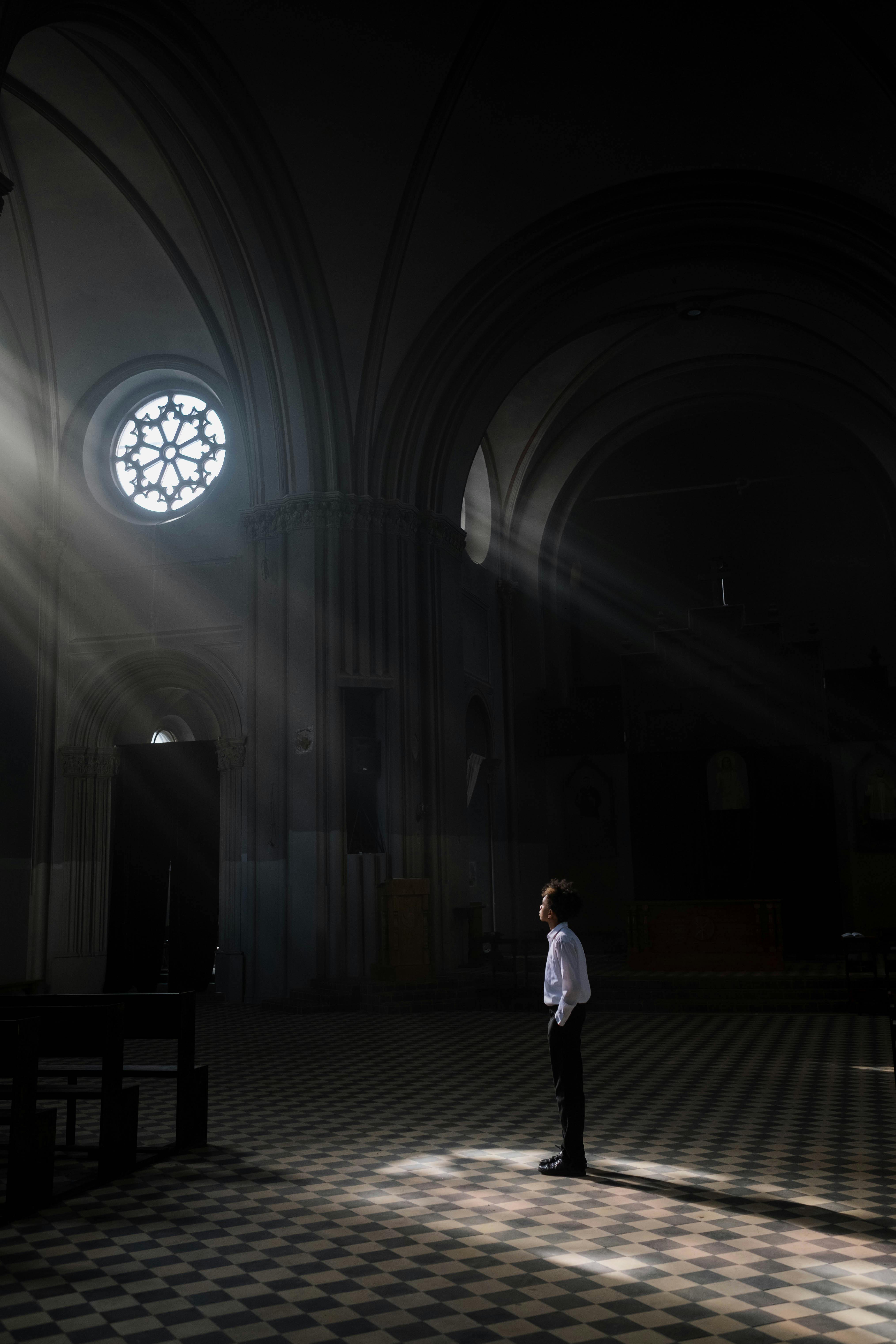 Back View of a Person Standing Inside a Church · Free Stock Photo