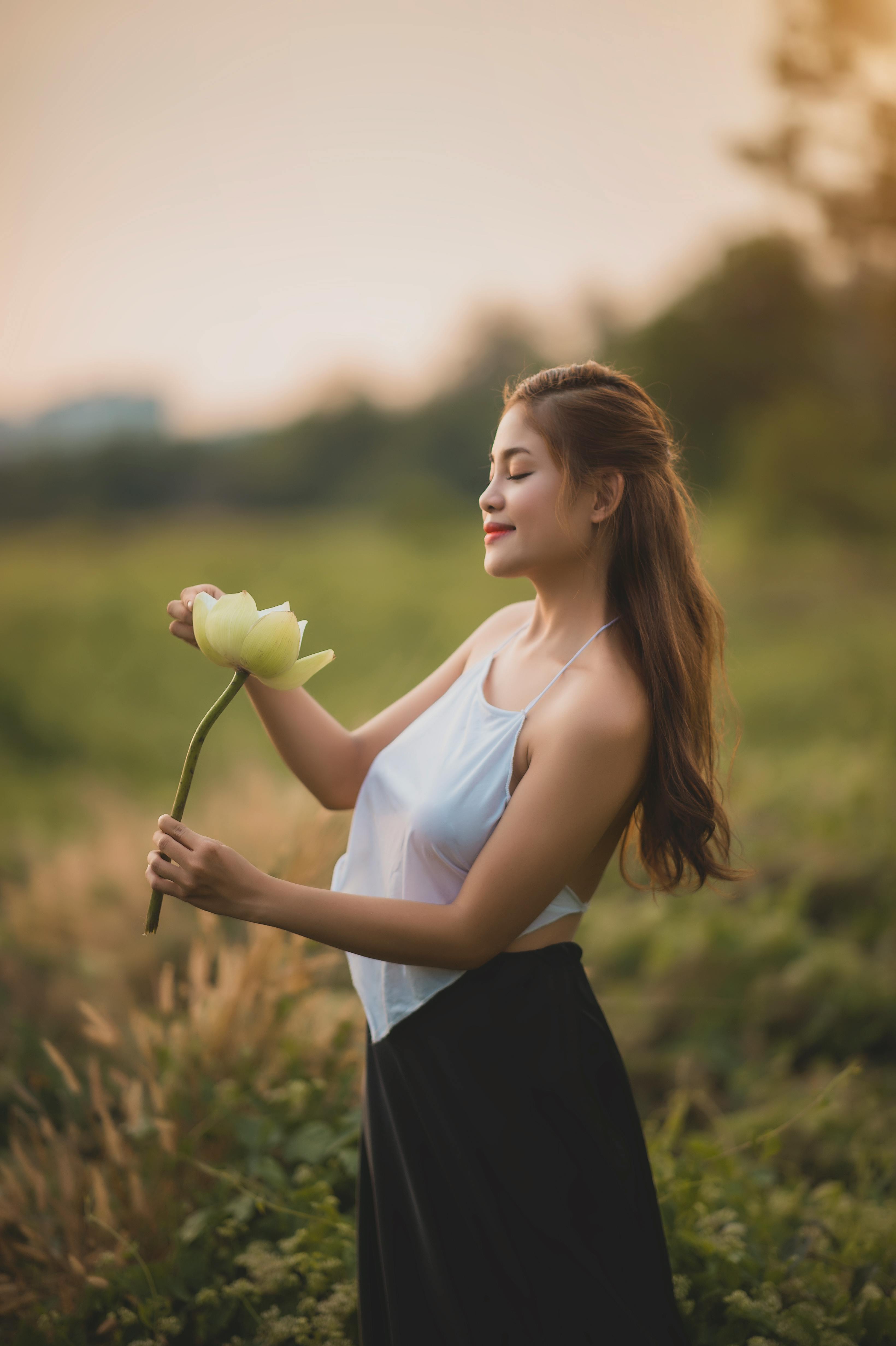 Woman Posing with Flower · Free Stock Photo