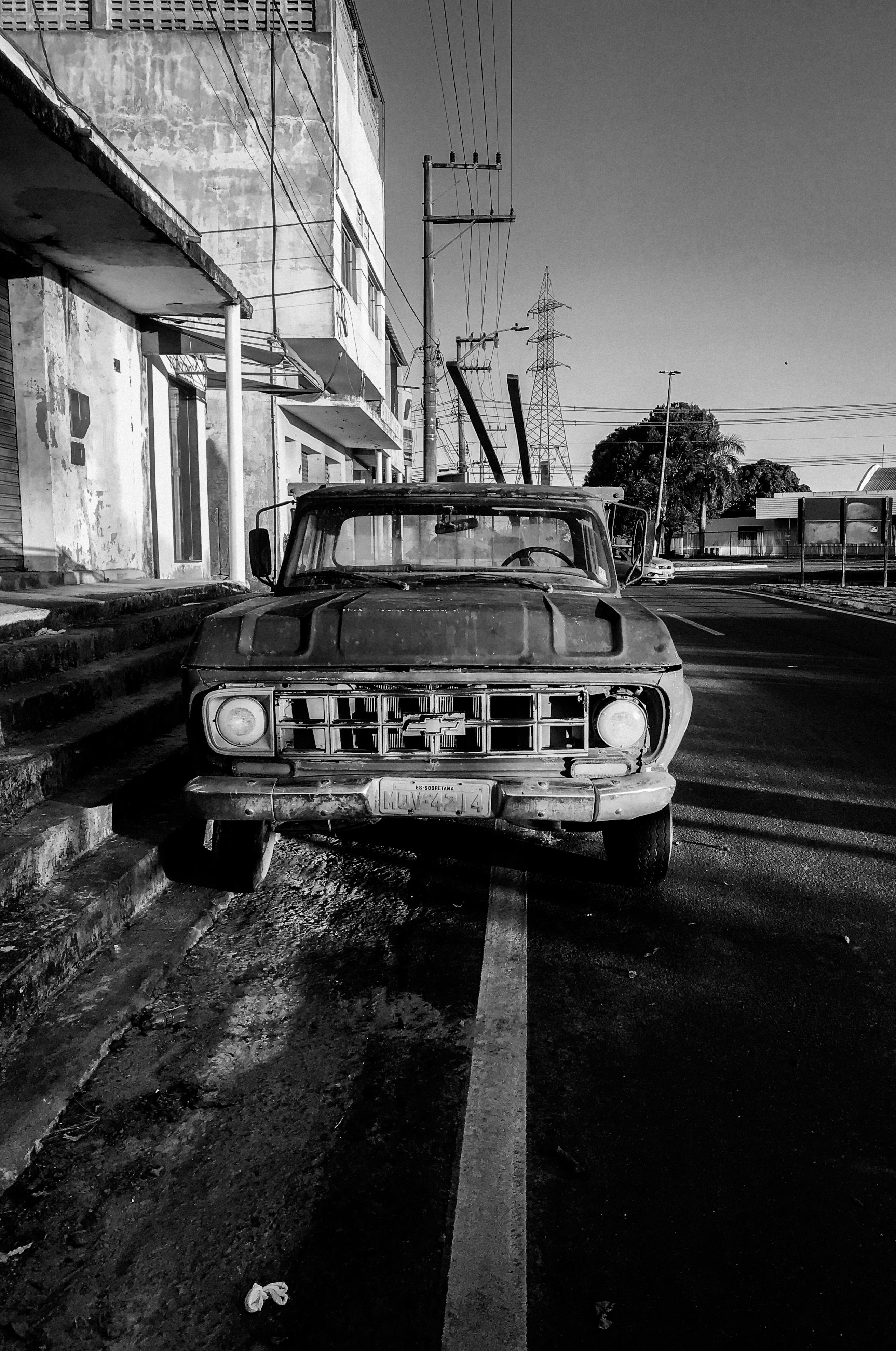 Grayscale Photo Of Broken Vehicles · Free Stock Photo