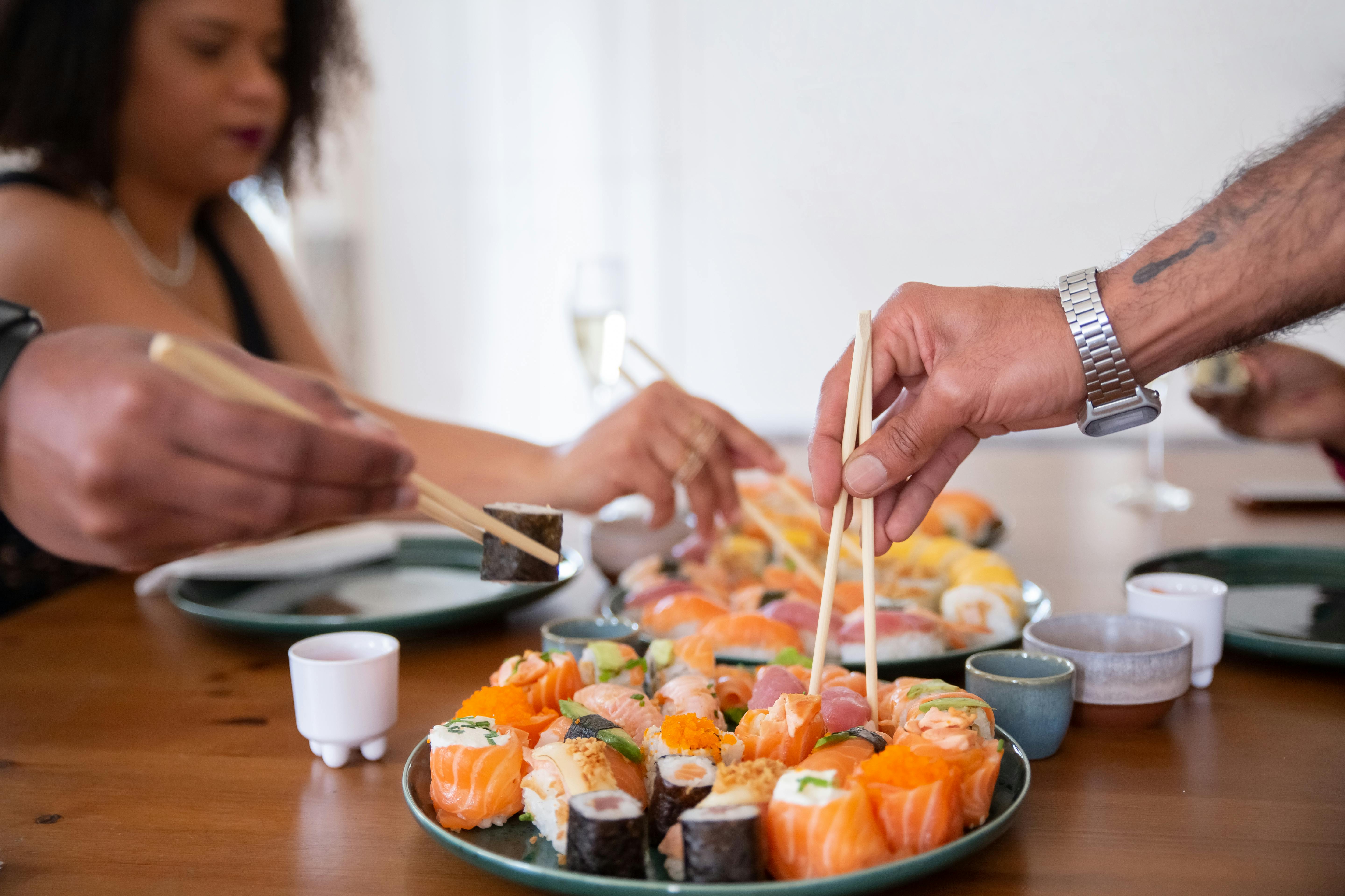 People Holding Chopsticks · Free Stock Photo