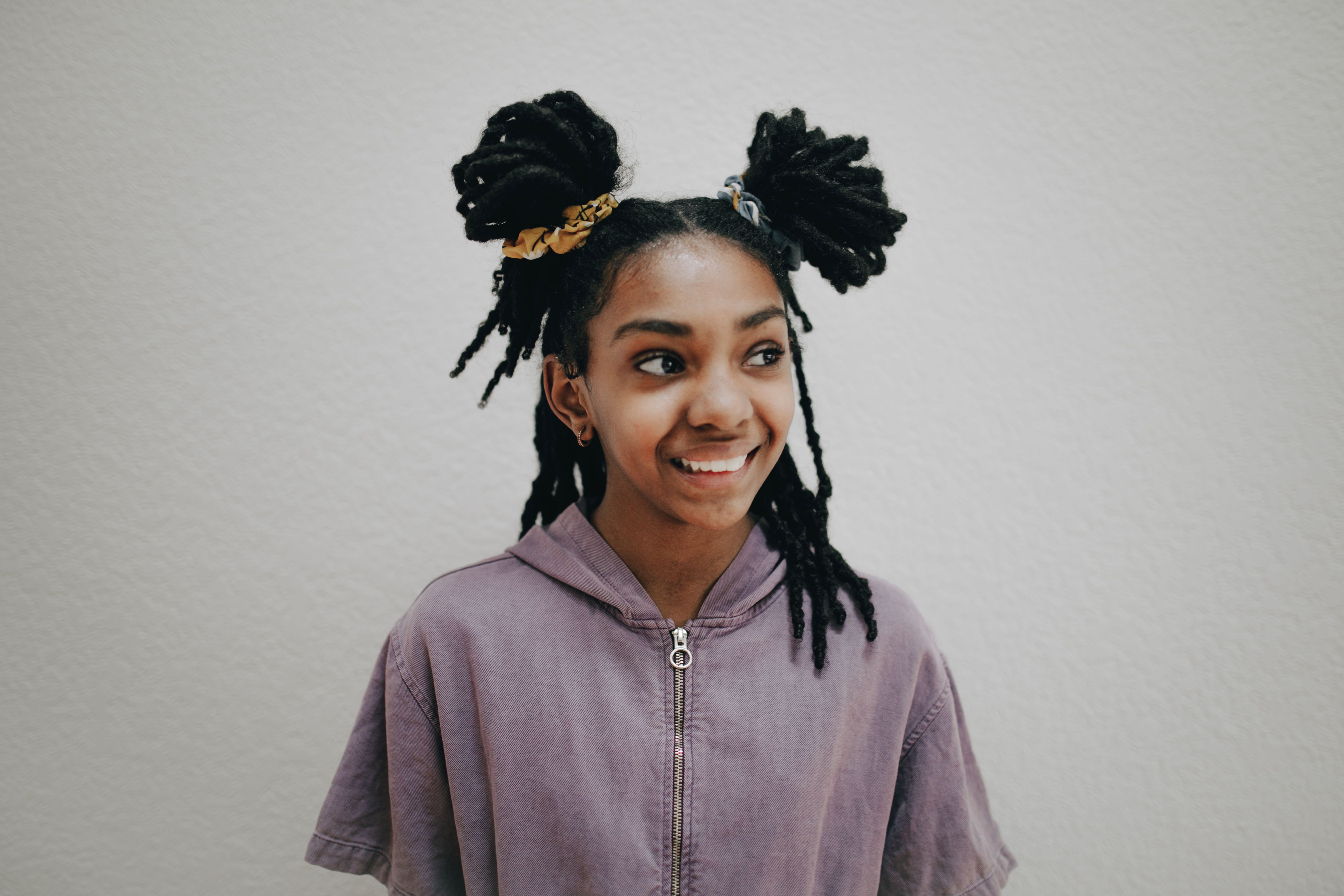 Photo of a Girl Smiling while Looking Sideways · Free Stock Photo