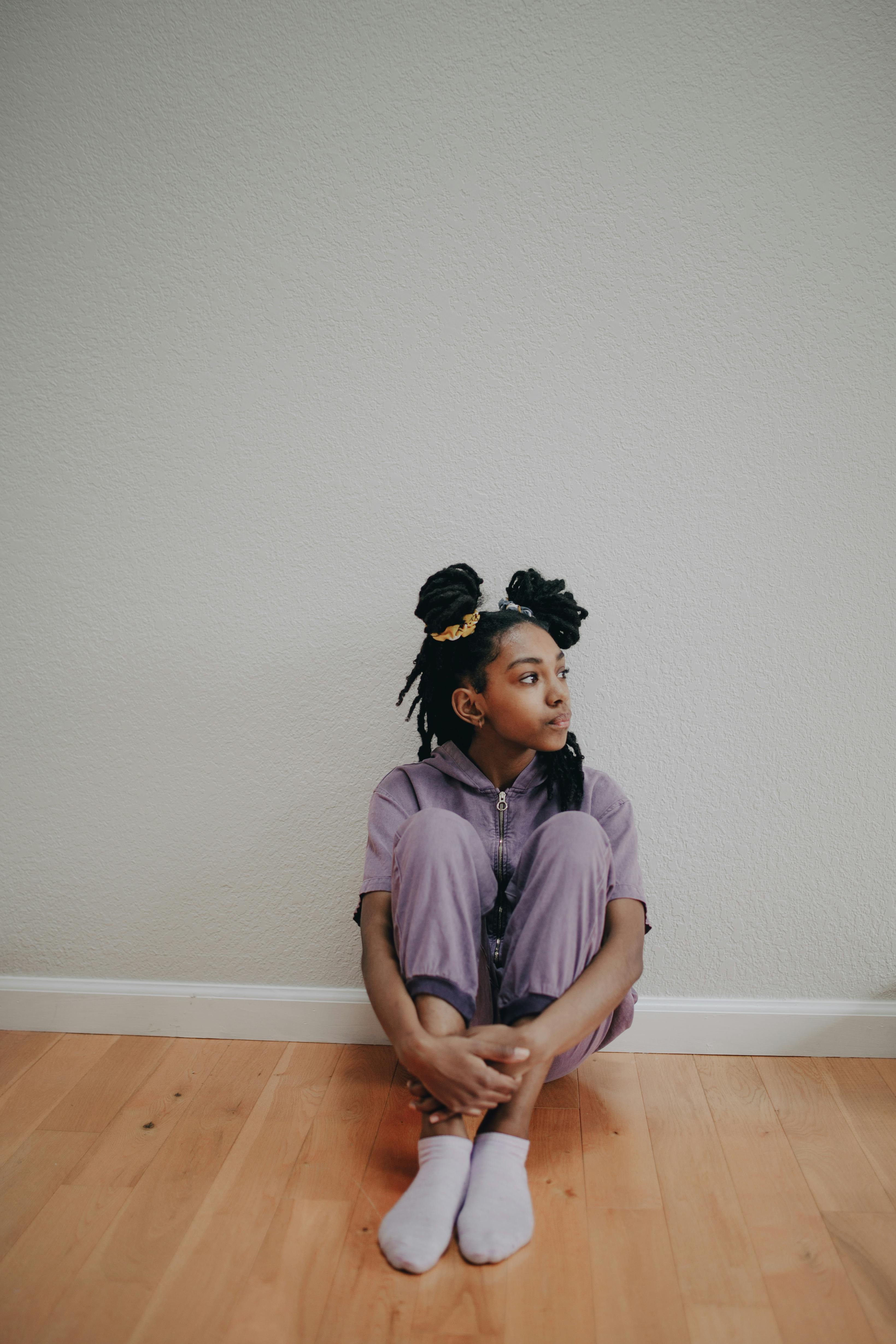 A Female Leaning on Concrete Wall · Free Stock Photo