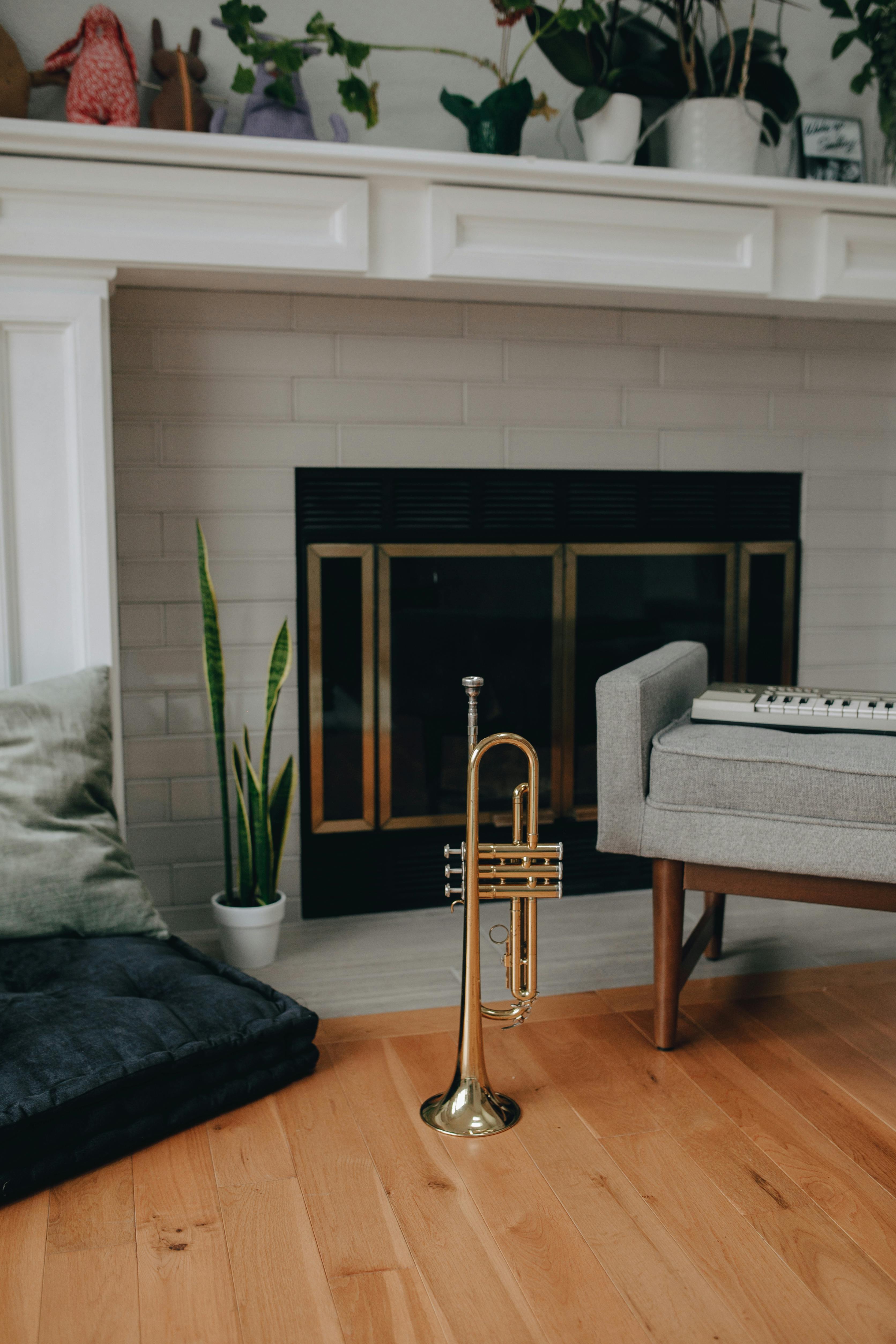 Brass Trumpet on Wooden Floor · Free Stock Photo
