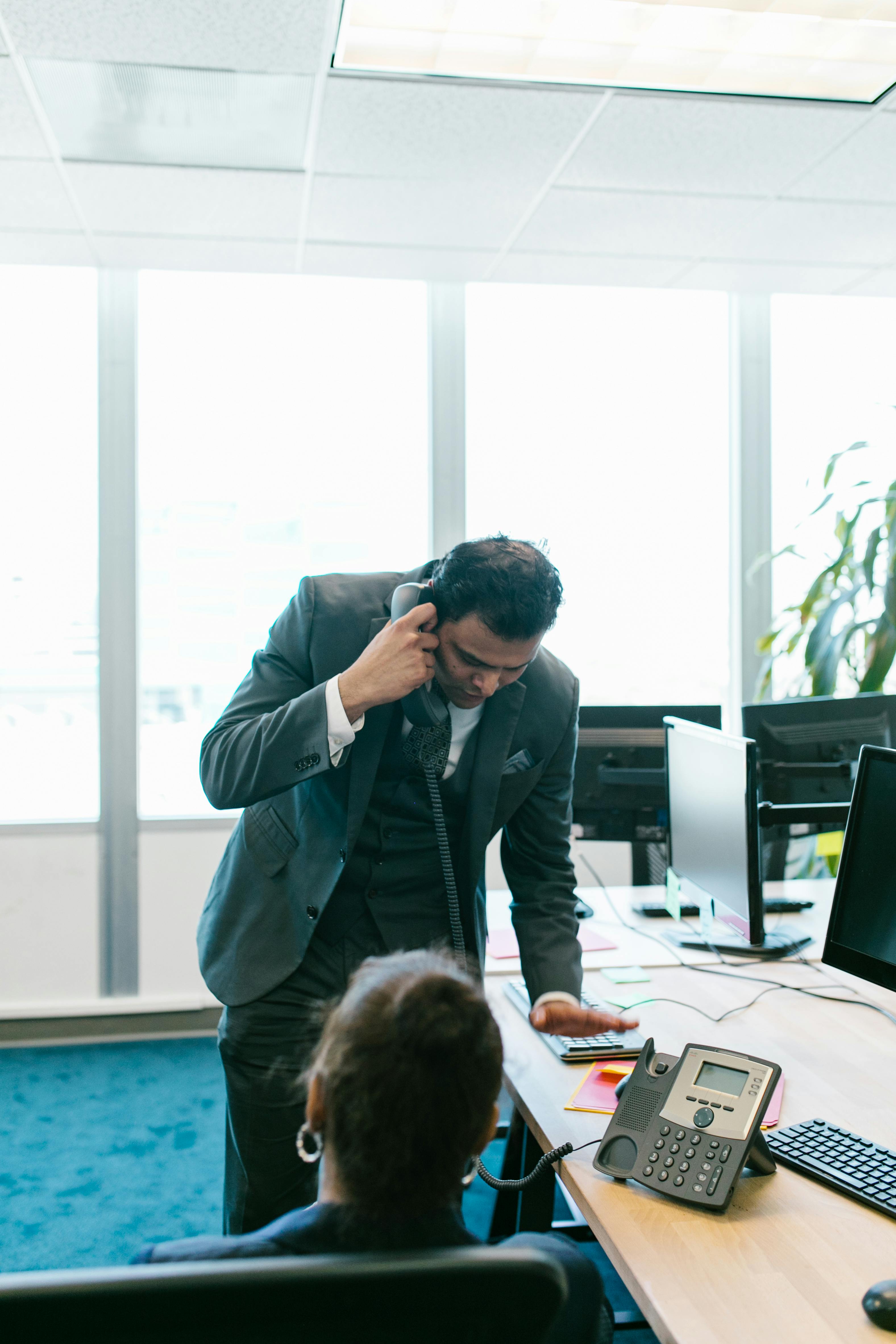 Man Fixing a Computer · Free Stock Photo
