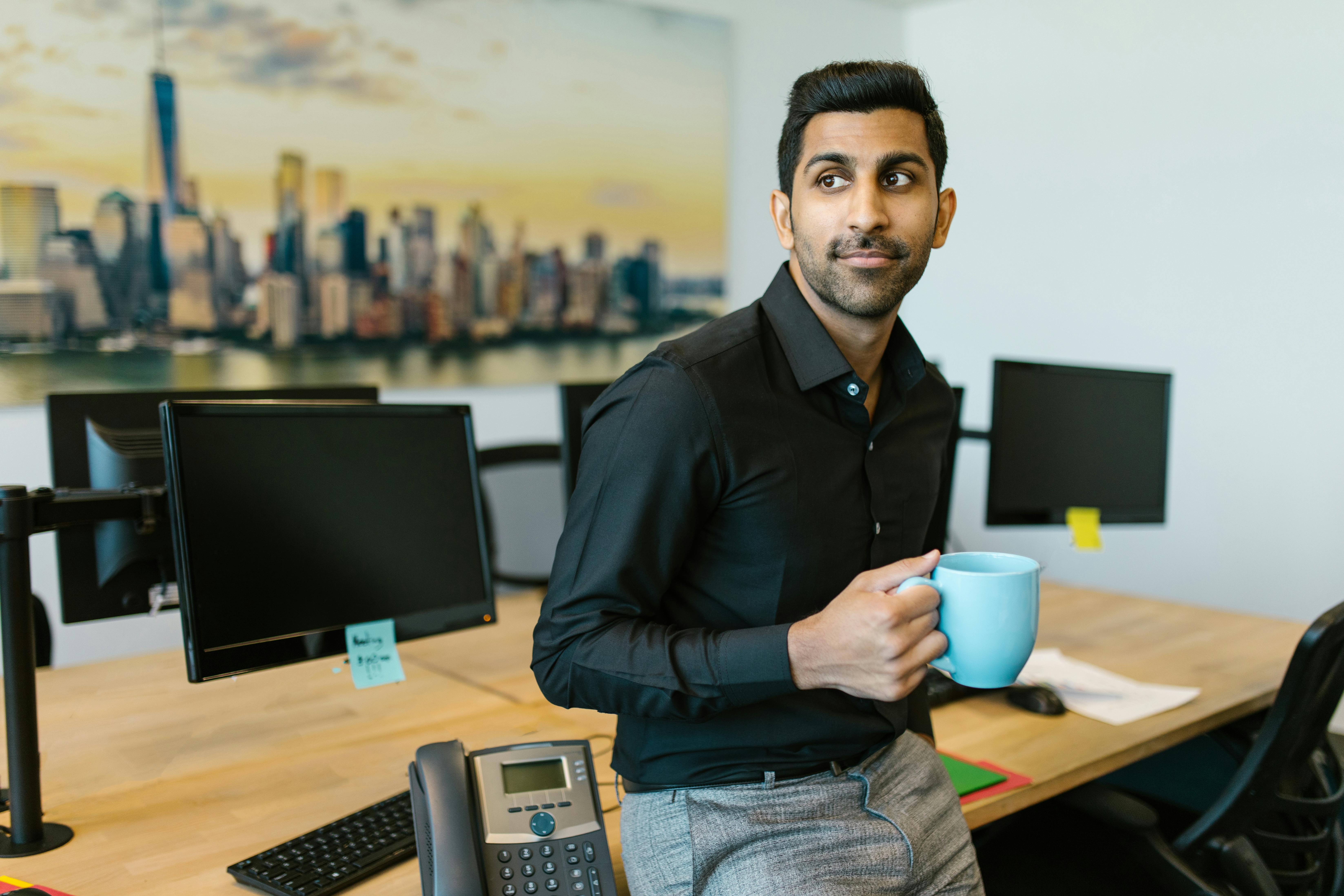 Man Sitting behind the Desk · Free Stock Photo