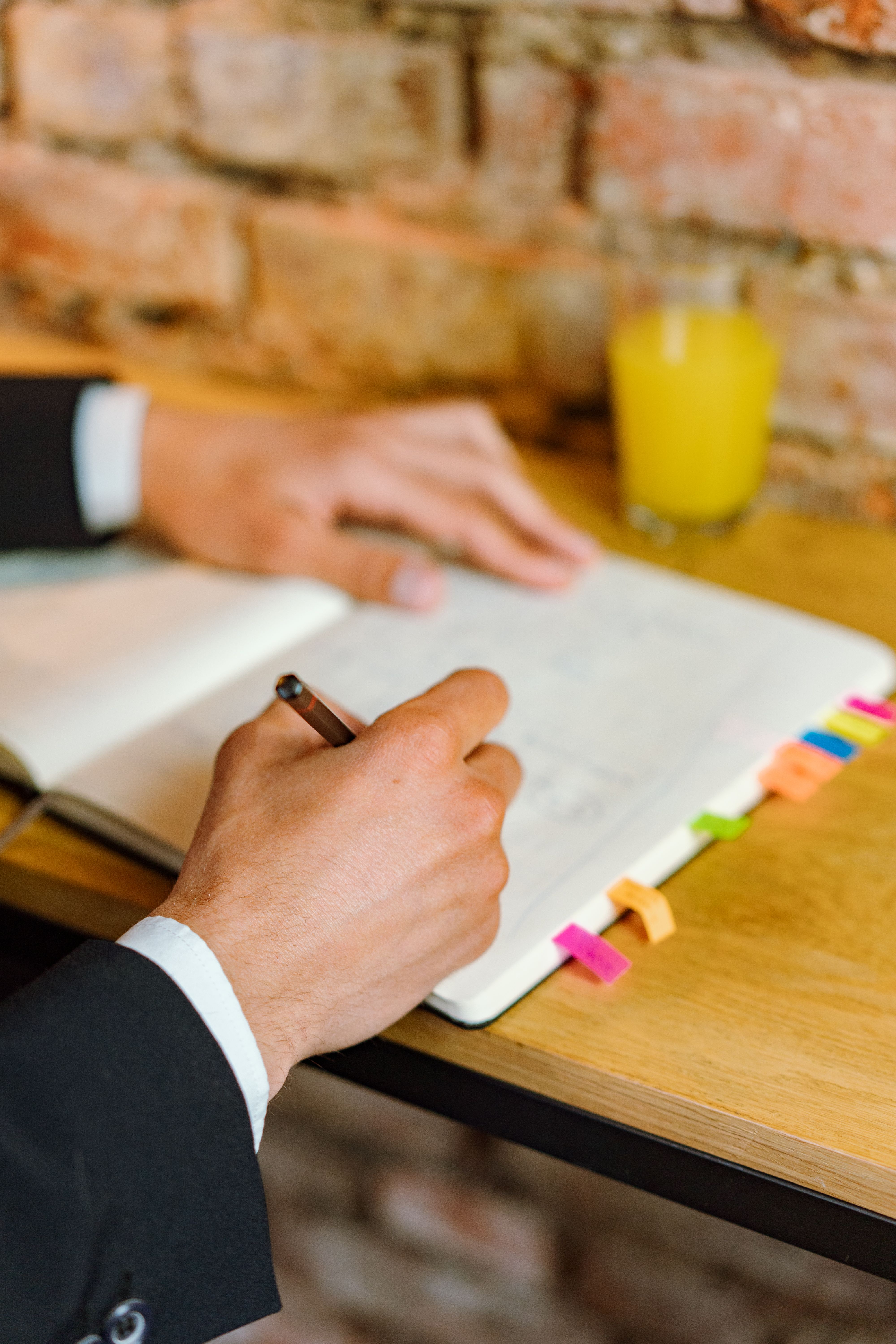 Person Writing on White Paper · Free Stock Photo
