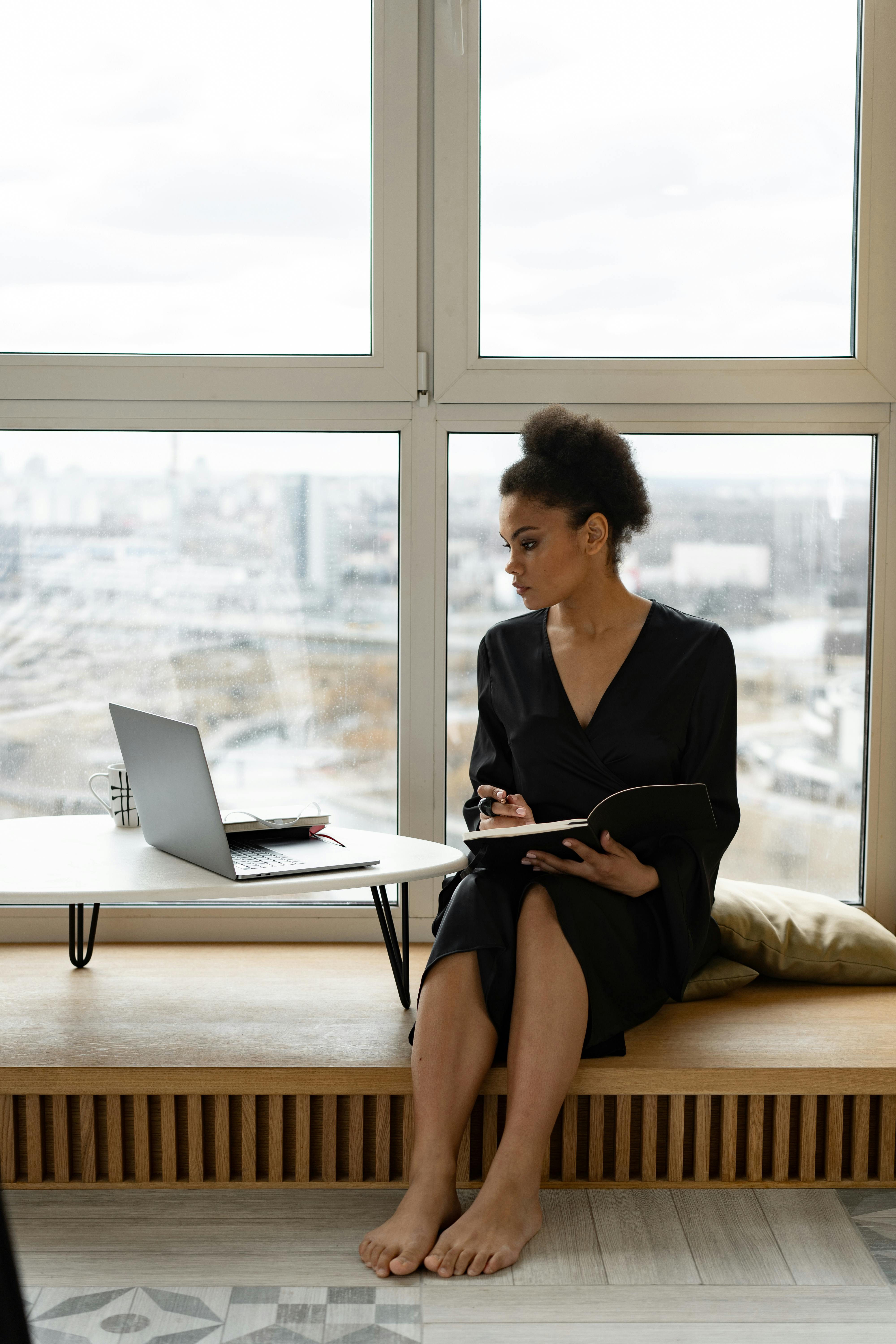 A Woman Looking the Notebook · Free Stock Photo