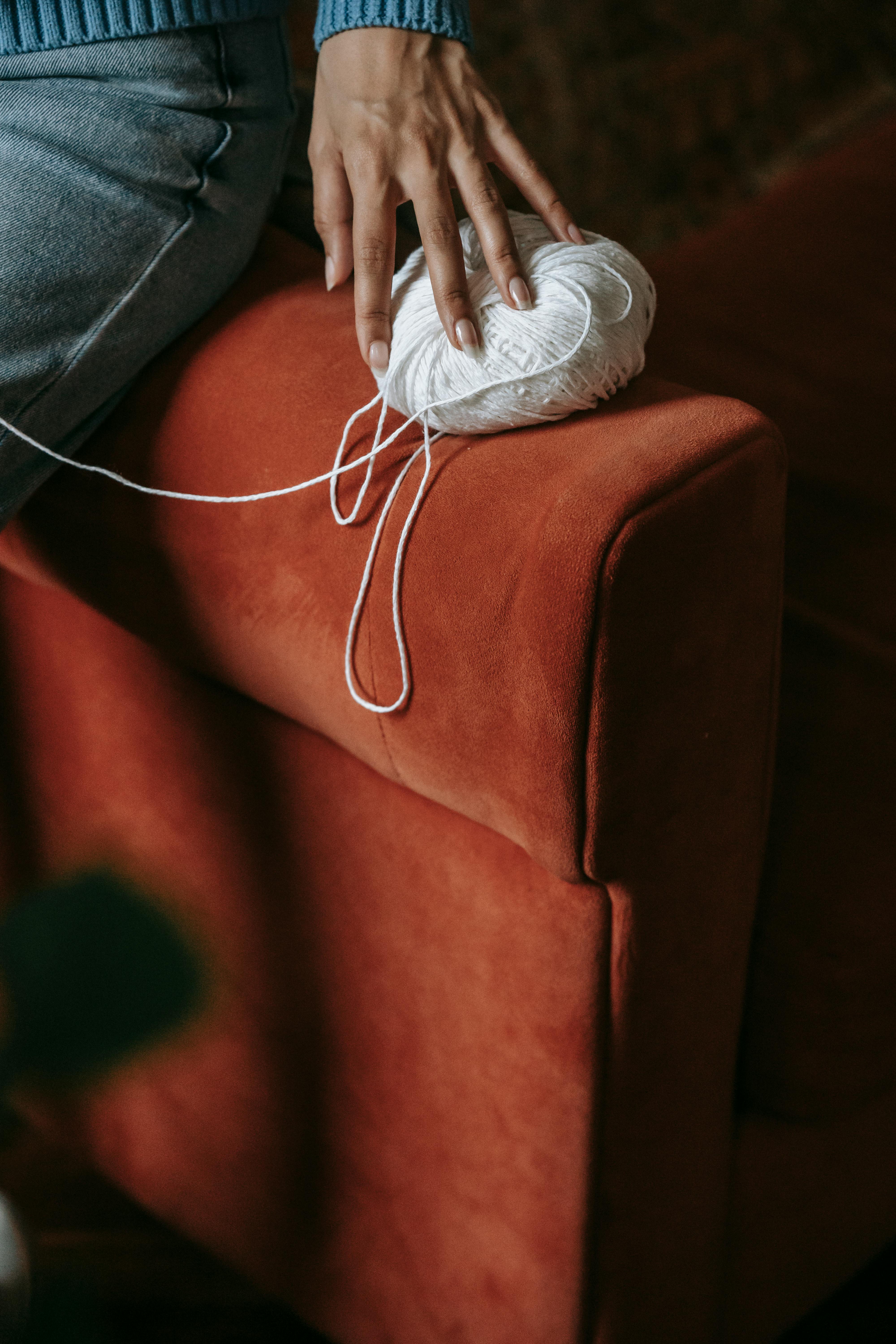 A Person Holding White Yarn · Free Stock Photo