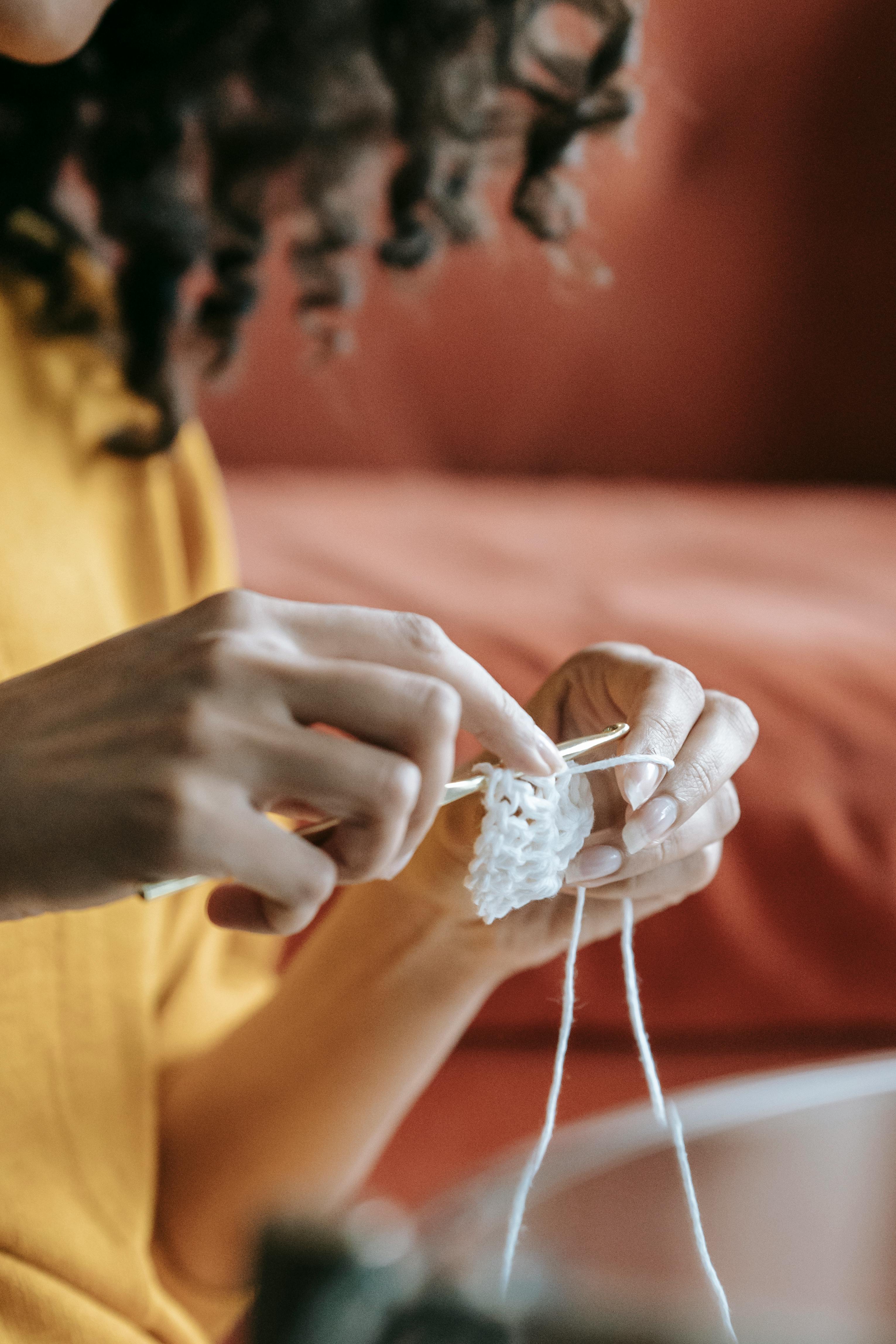 Close Up Shot of a Person Knitting · Free Stock Photo