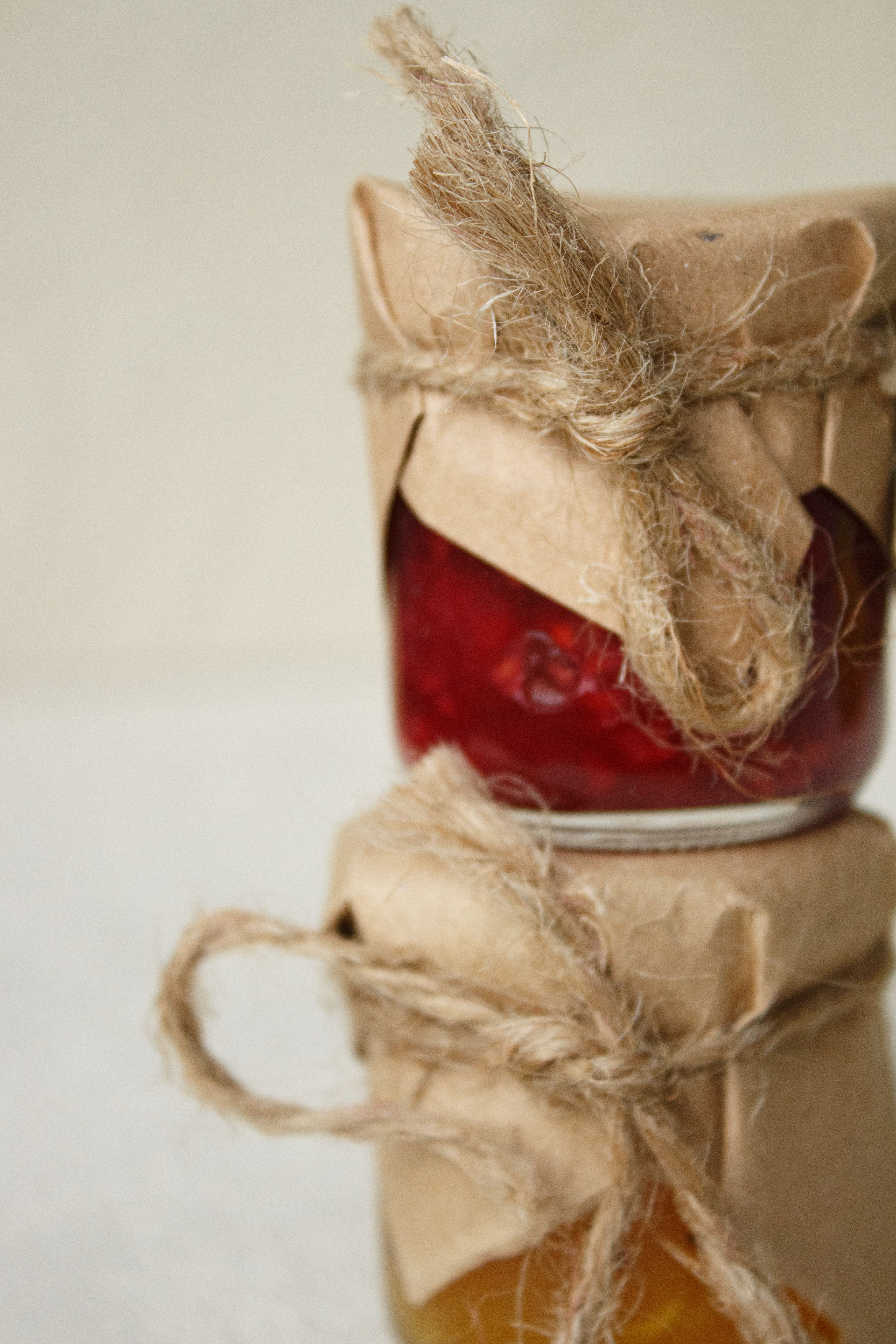 Jams Covered in Kraft Paper · Free Stock Photo