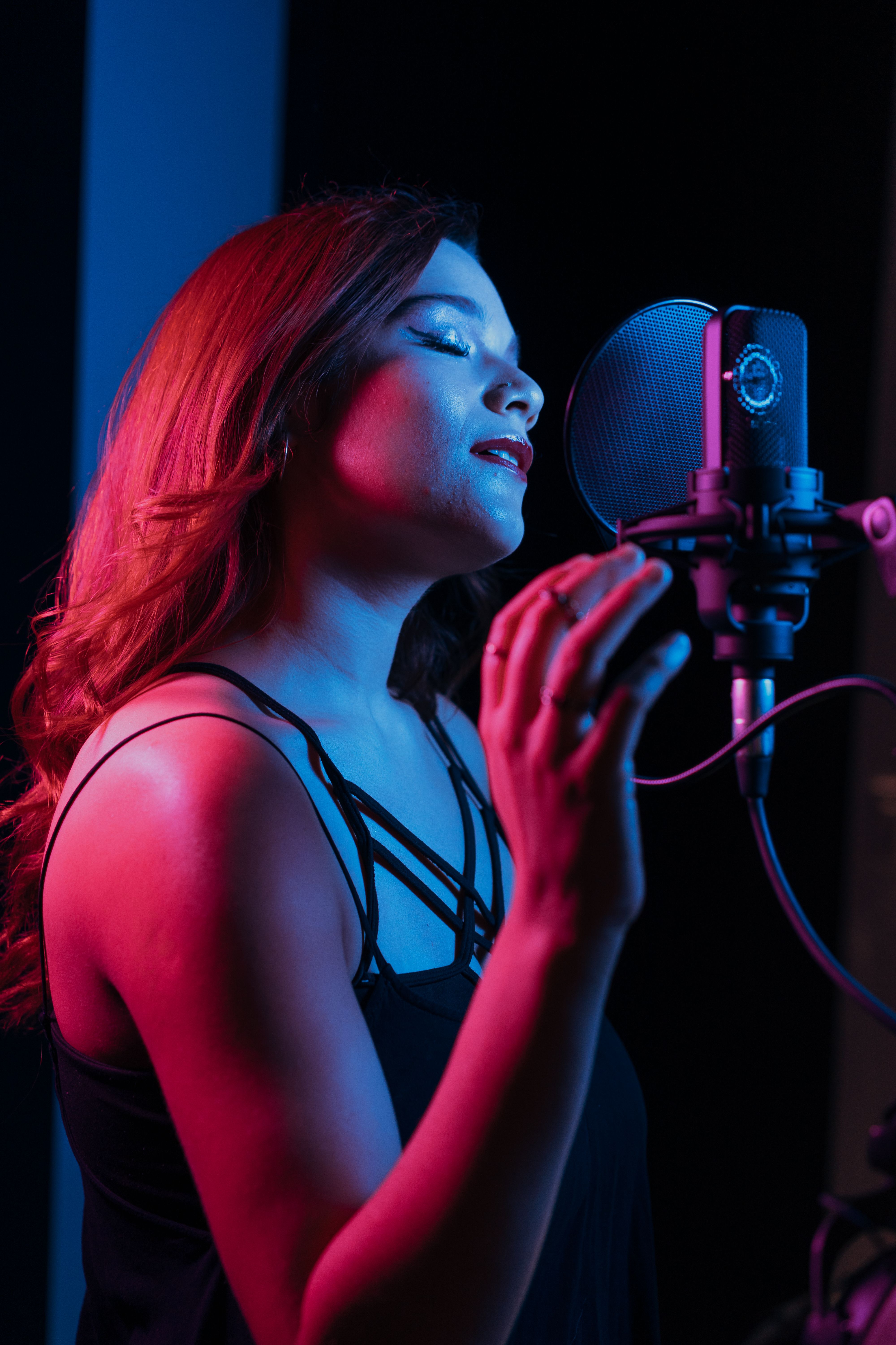 Close-Up Shot of Person Singing · Free Stock Photo