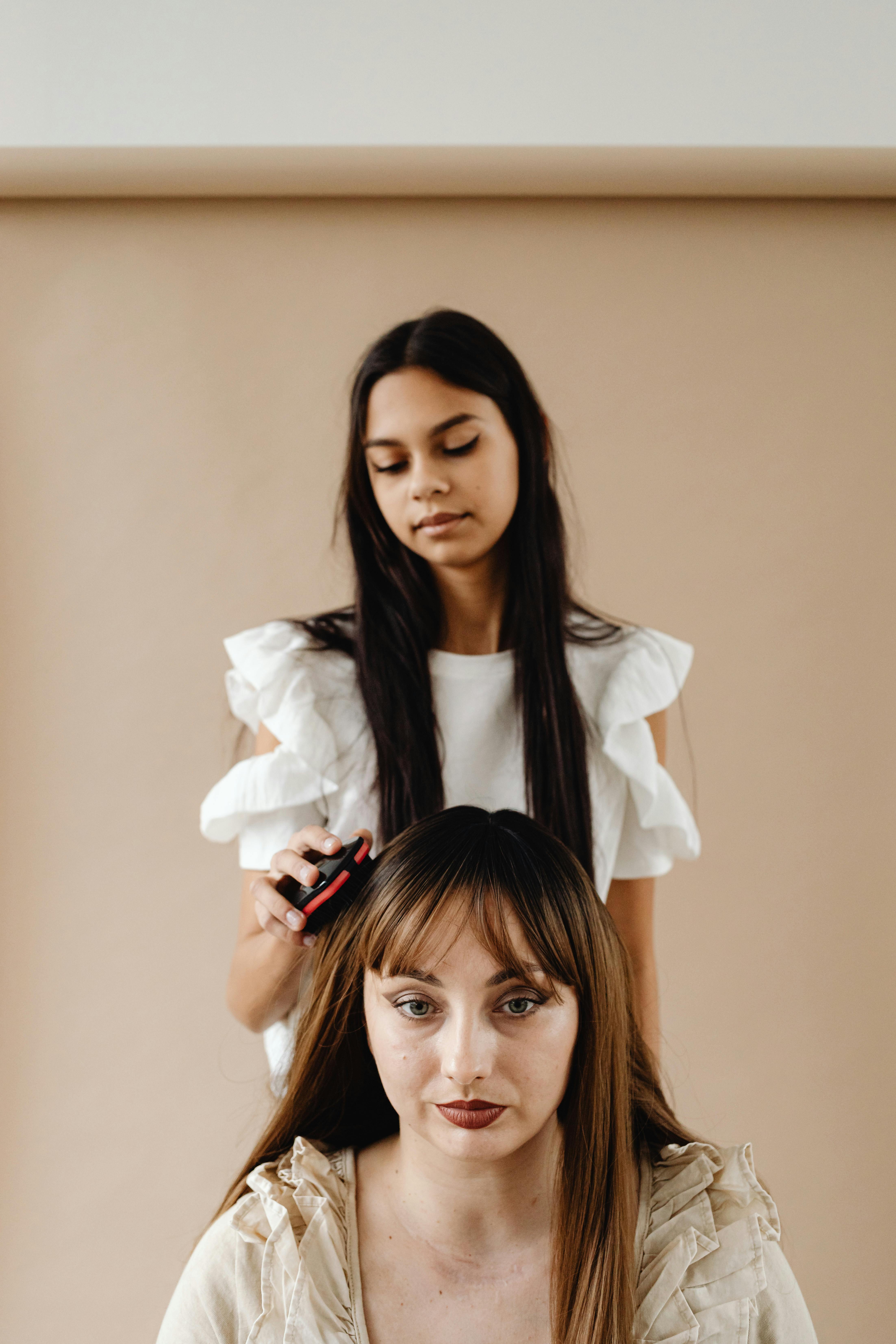Women Brushing Hair · Free Stock Photo