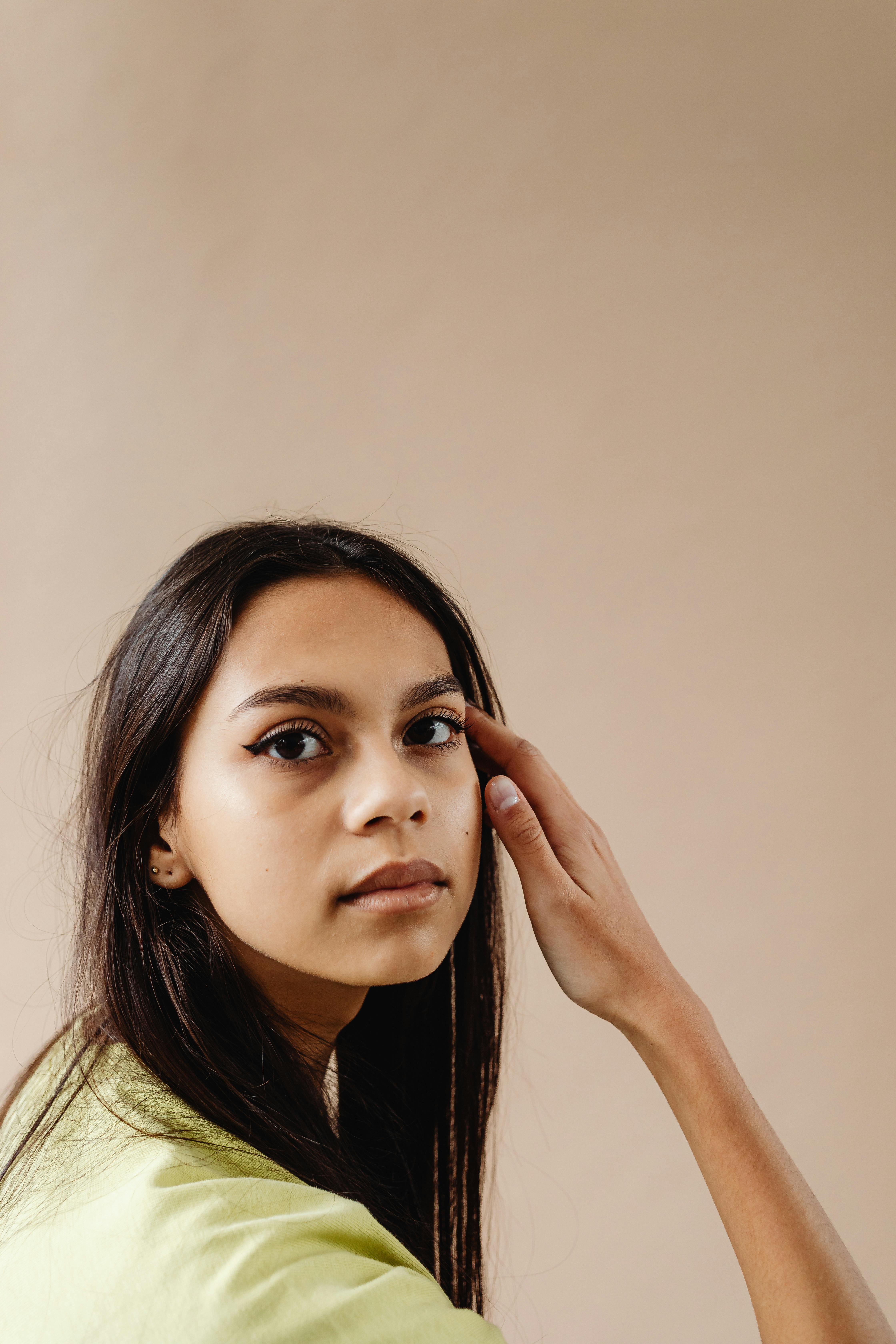 Woman with Hand on Face · Free Stock Photo