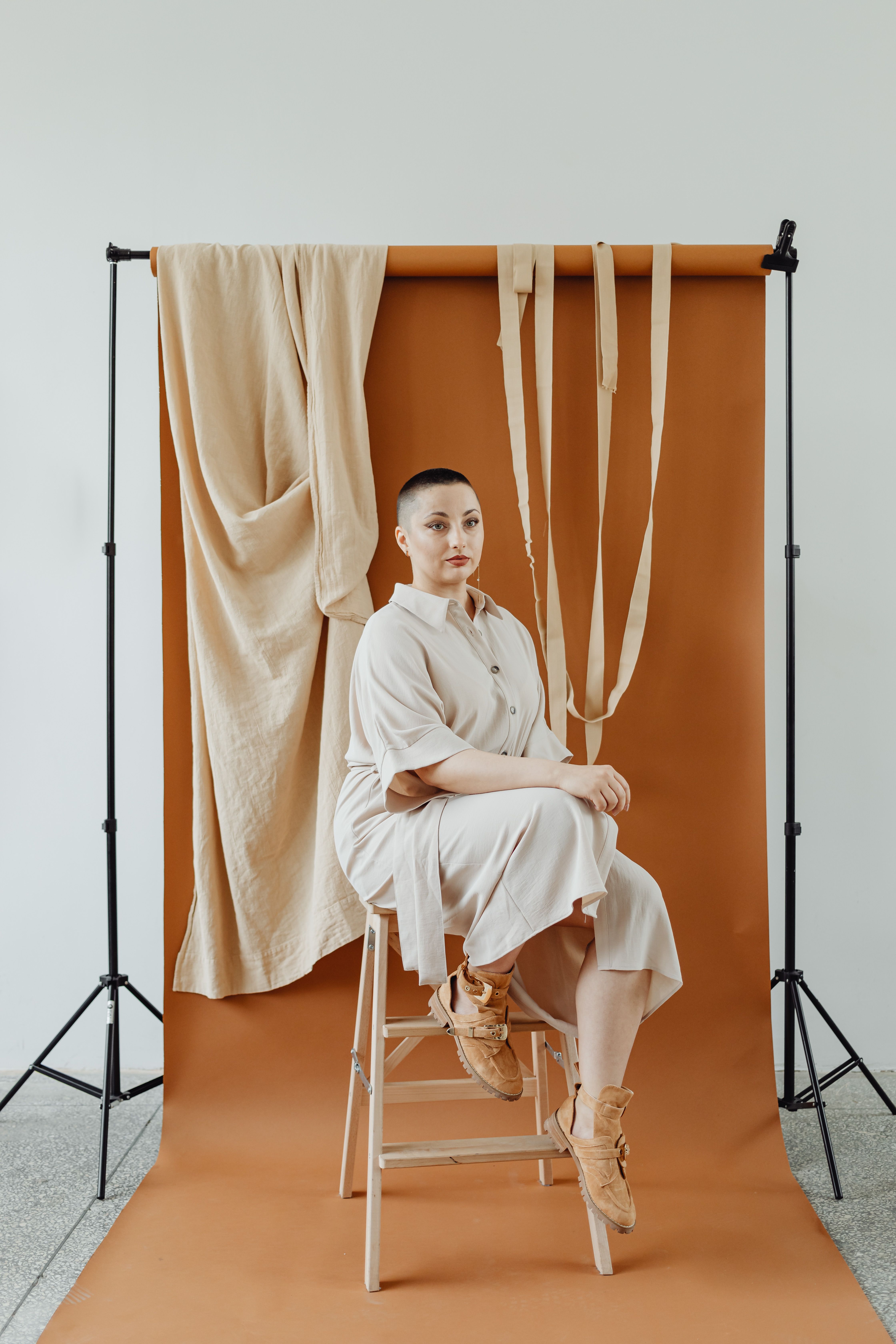 Woman in White Robe Sitting on Chair · Free Stock Photo
