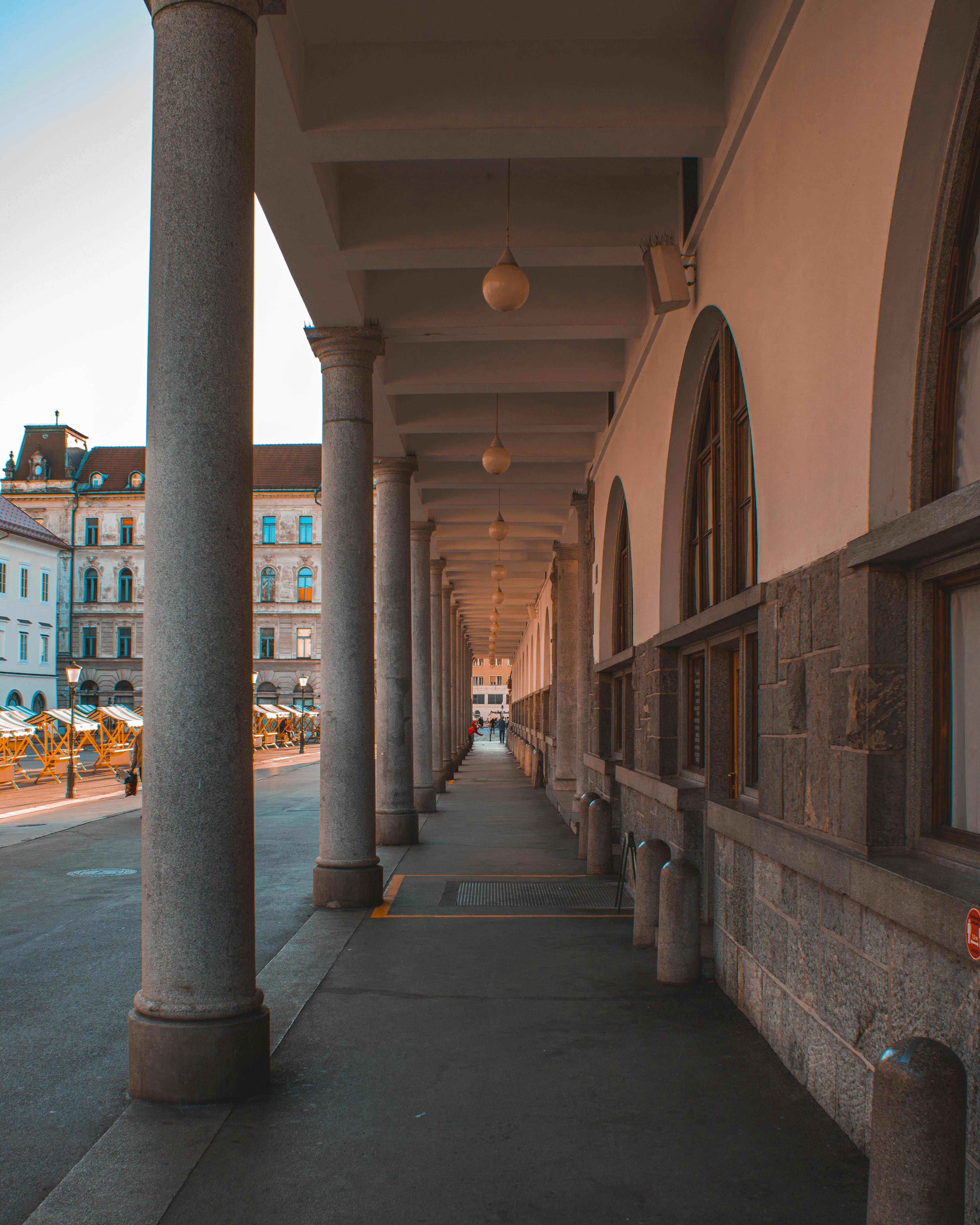 Sidewalk under Arcade Supported by Colonnade · Free Stock Photo