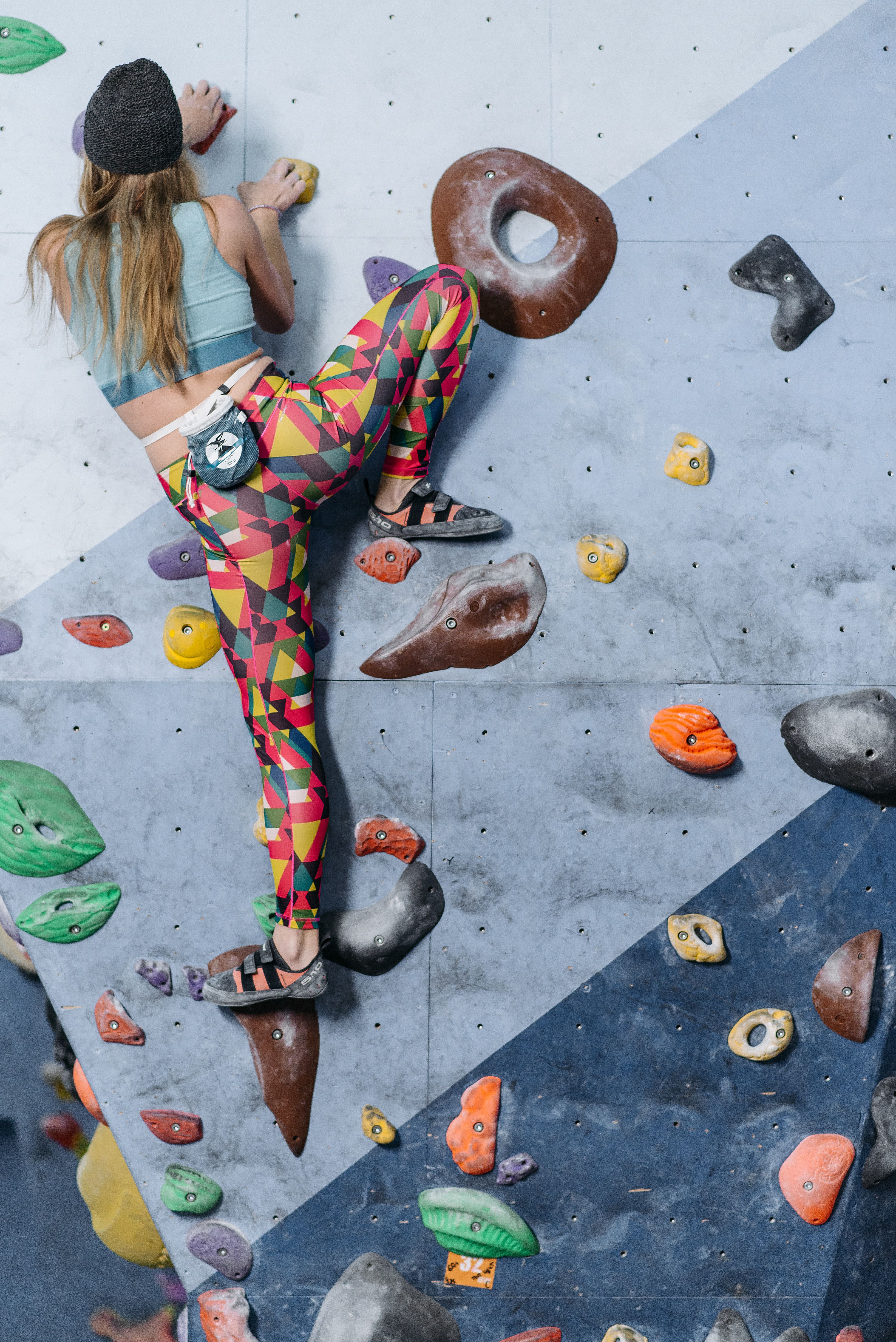 A Woman Climbing on the Wall · Free Stock Photo