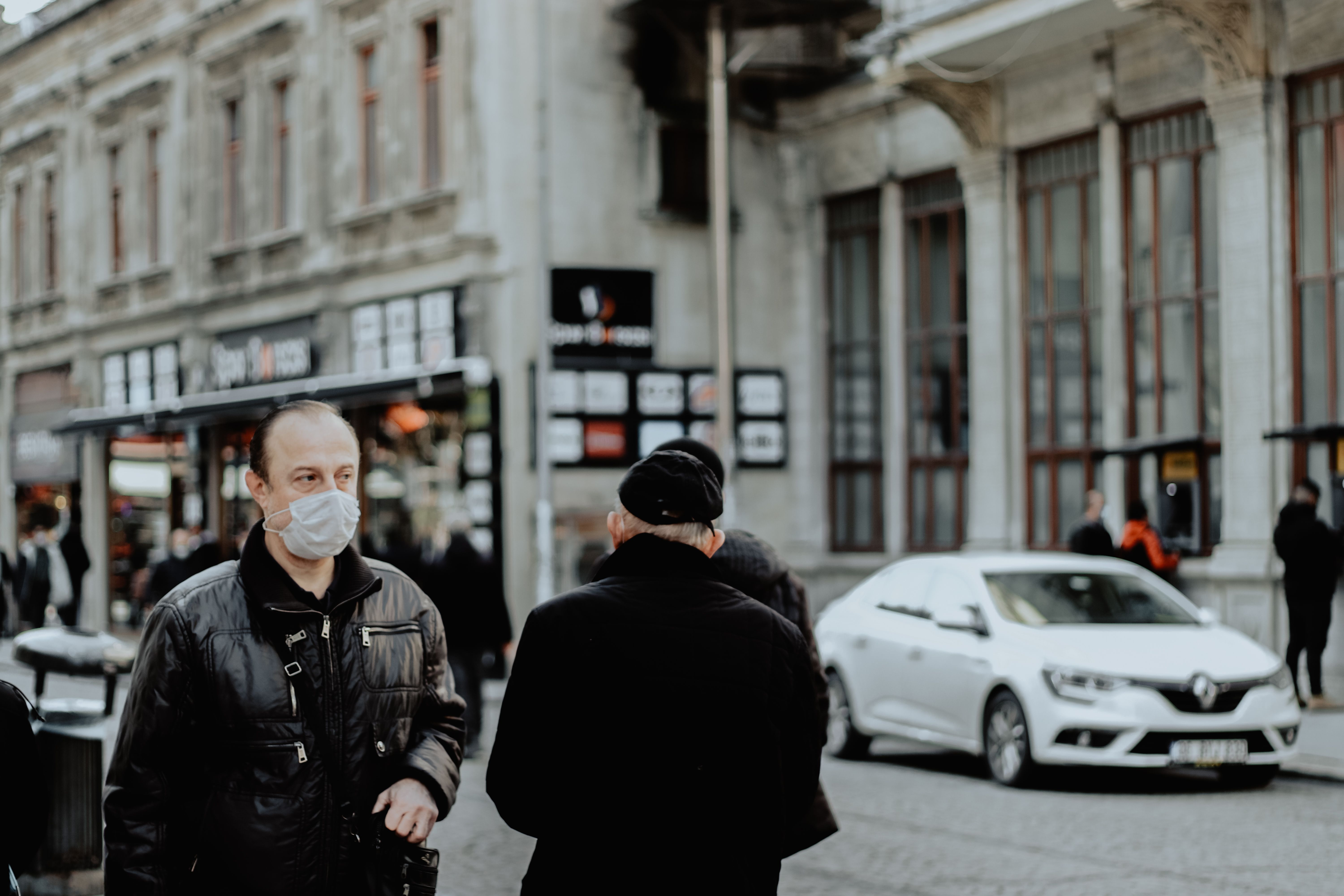 Man Wearing Face Mask on City Street · Free Stock Photo