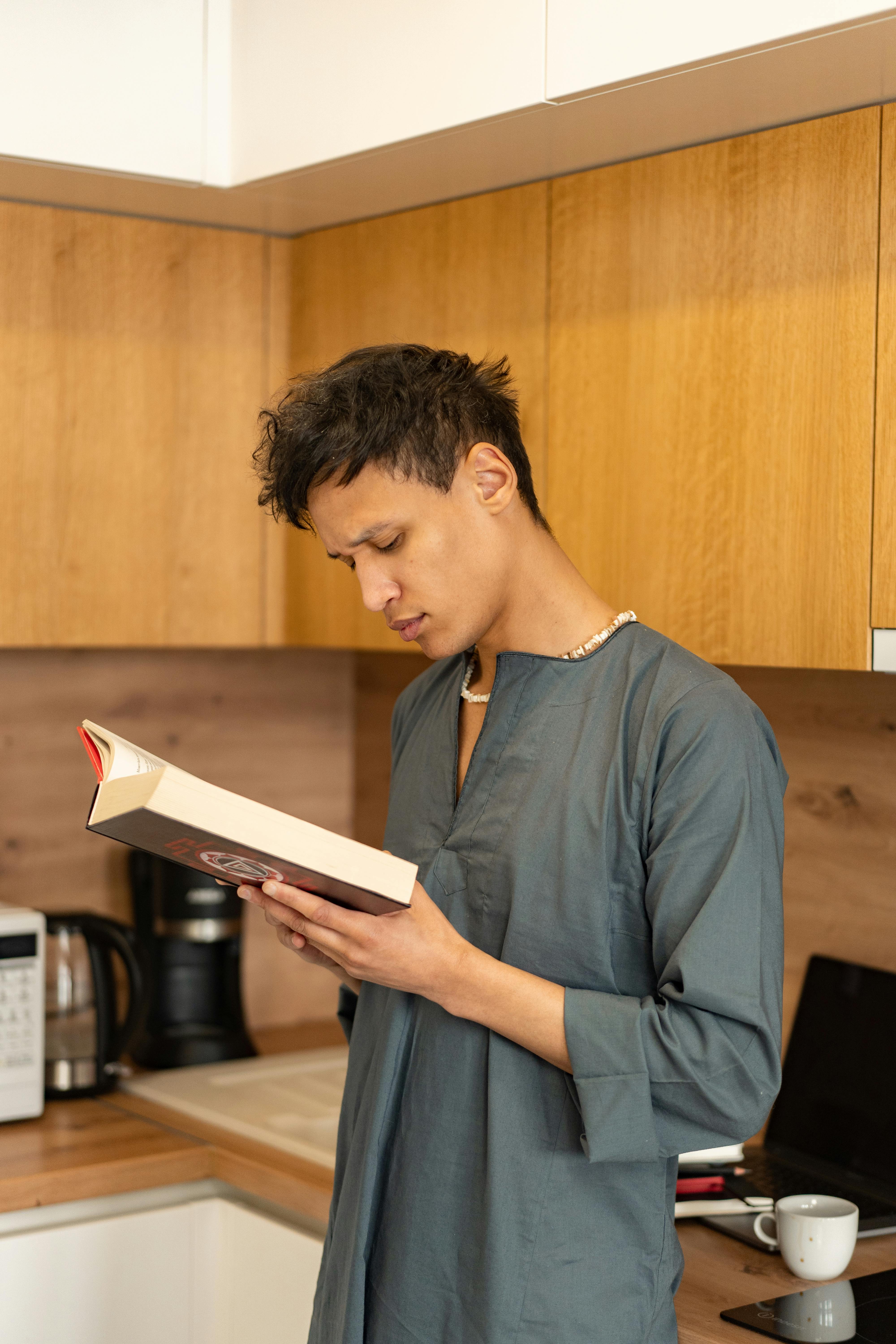 Man Reading a Book Inside the House · Free Stock Photo