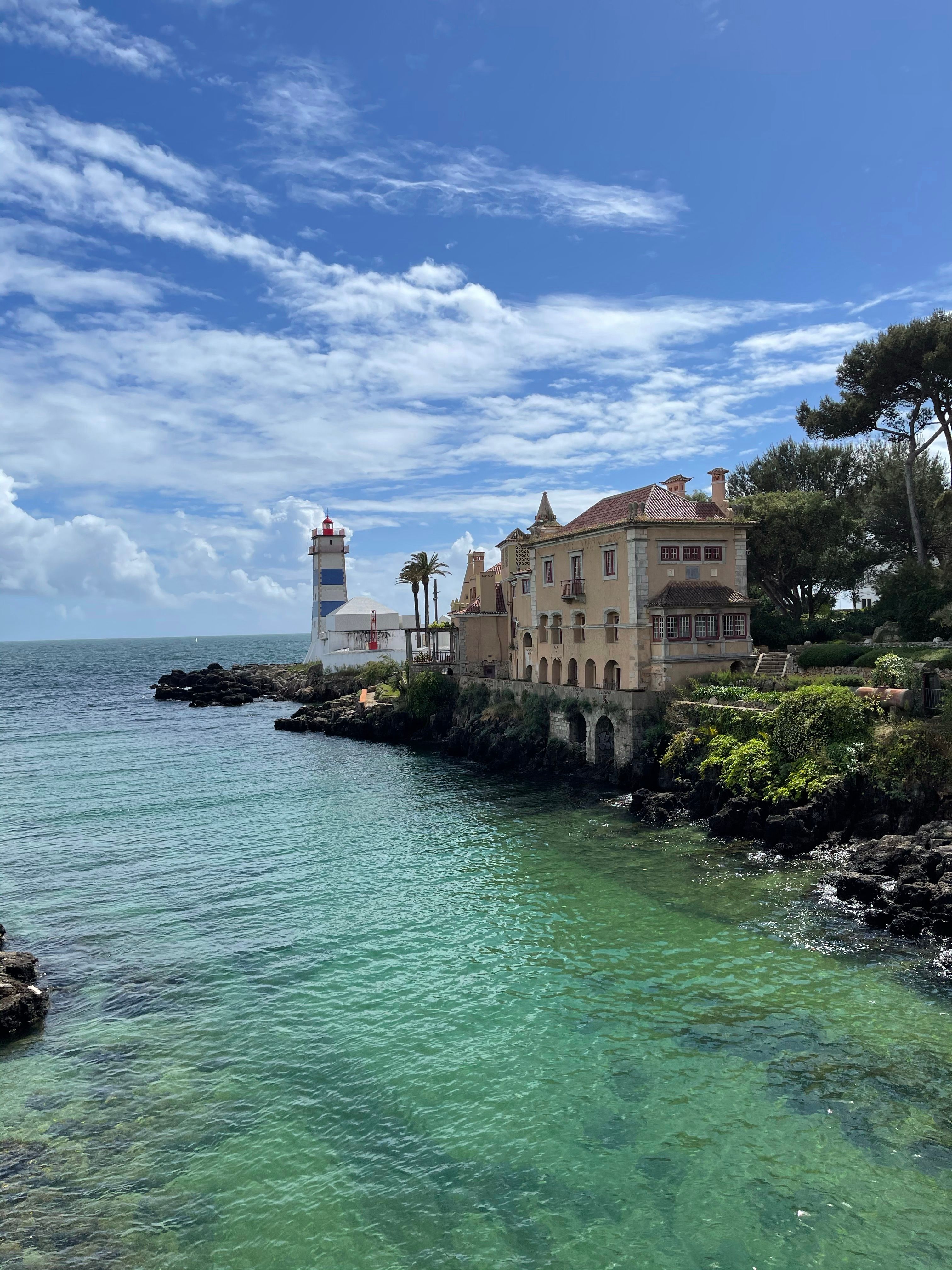 Landscape with Building, Lighthouse and Sea · Free Stock Photo