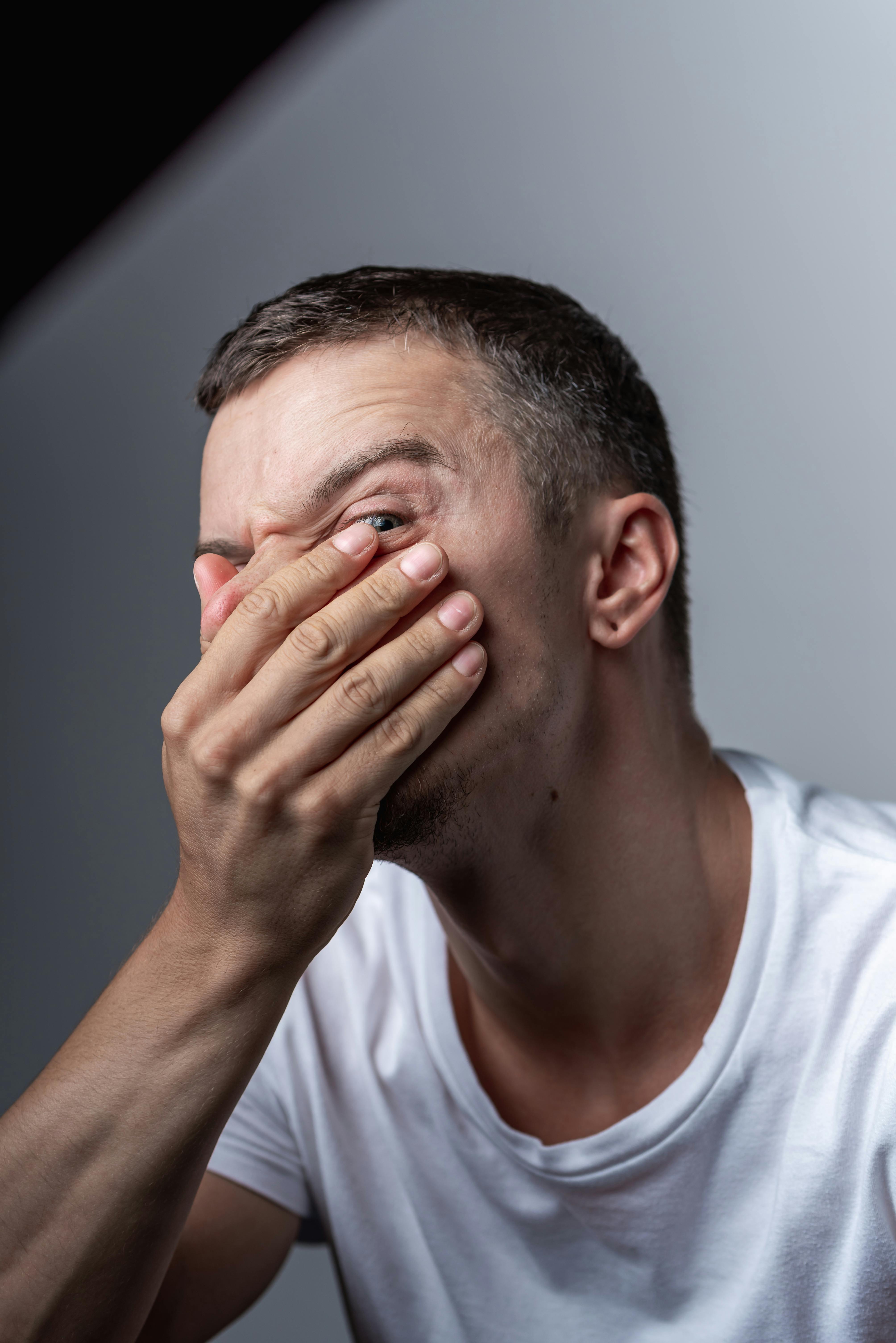 Man Doing Indian Sit Covering His Face With Hands · Free Stock Photo