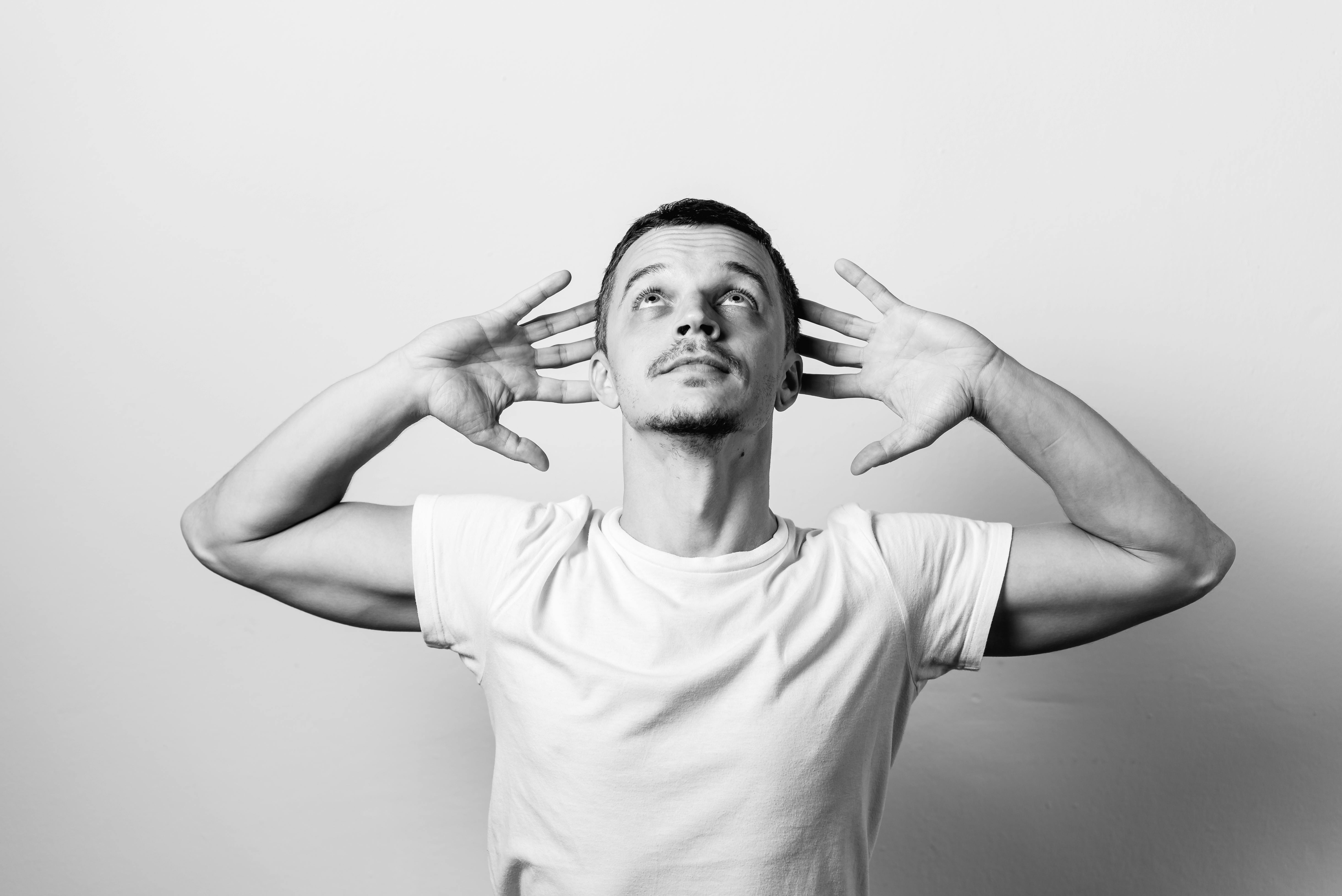 Man's Hand Reaching His Nape · Free Stock Photo