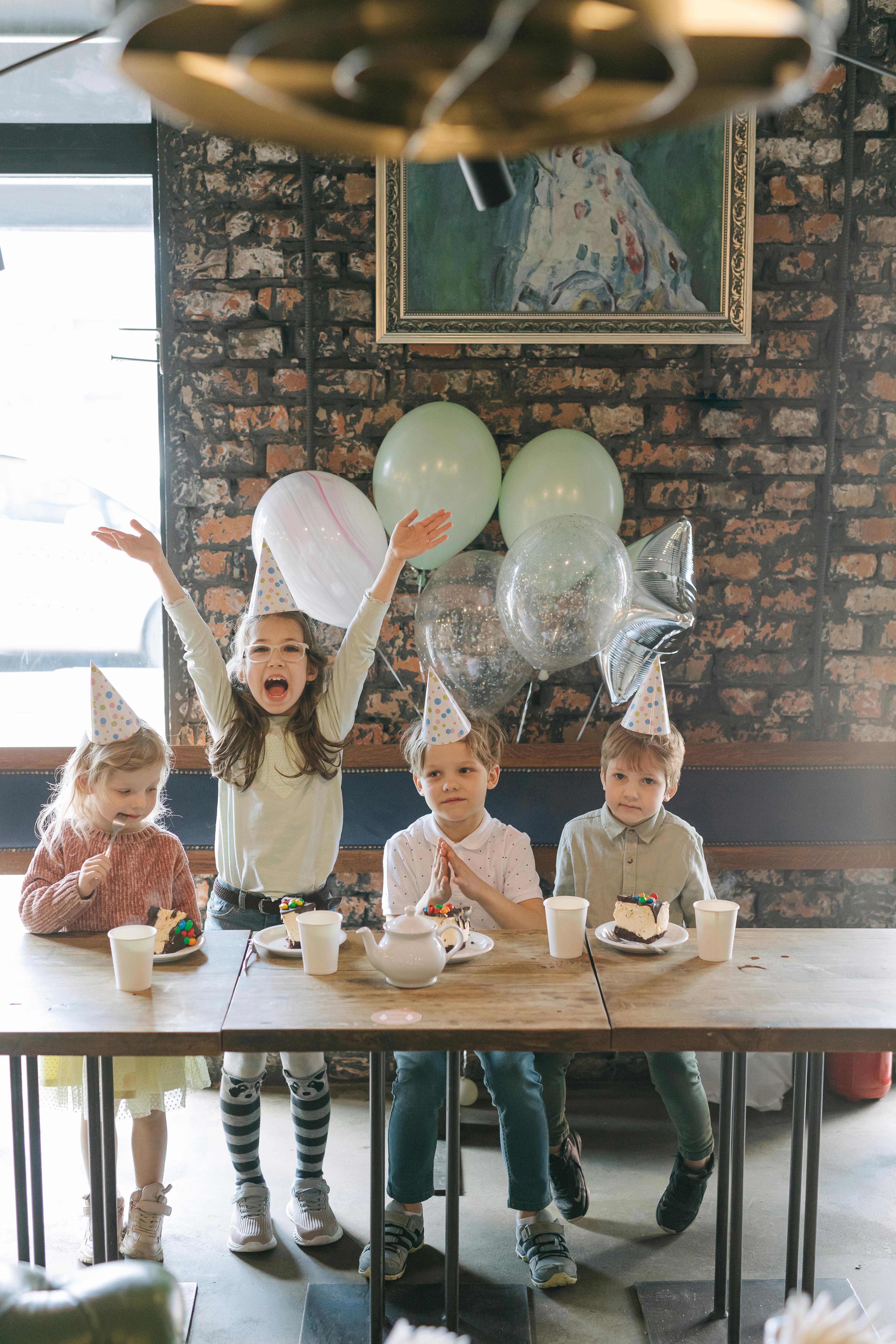 Happy Kids on a Party Sitting on a Chair · Free Stock Photo