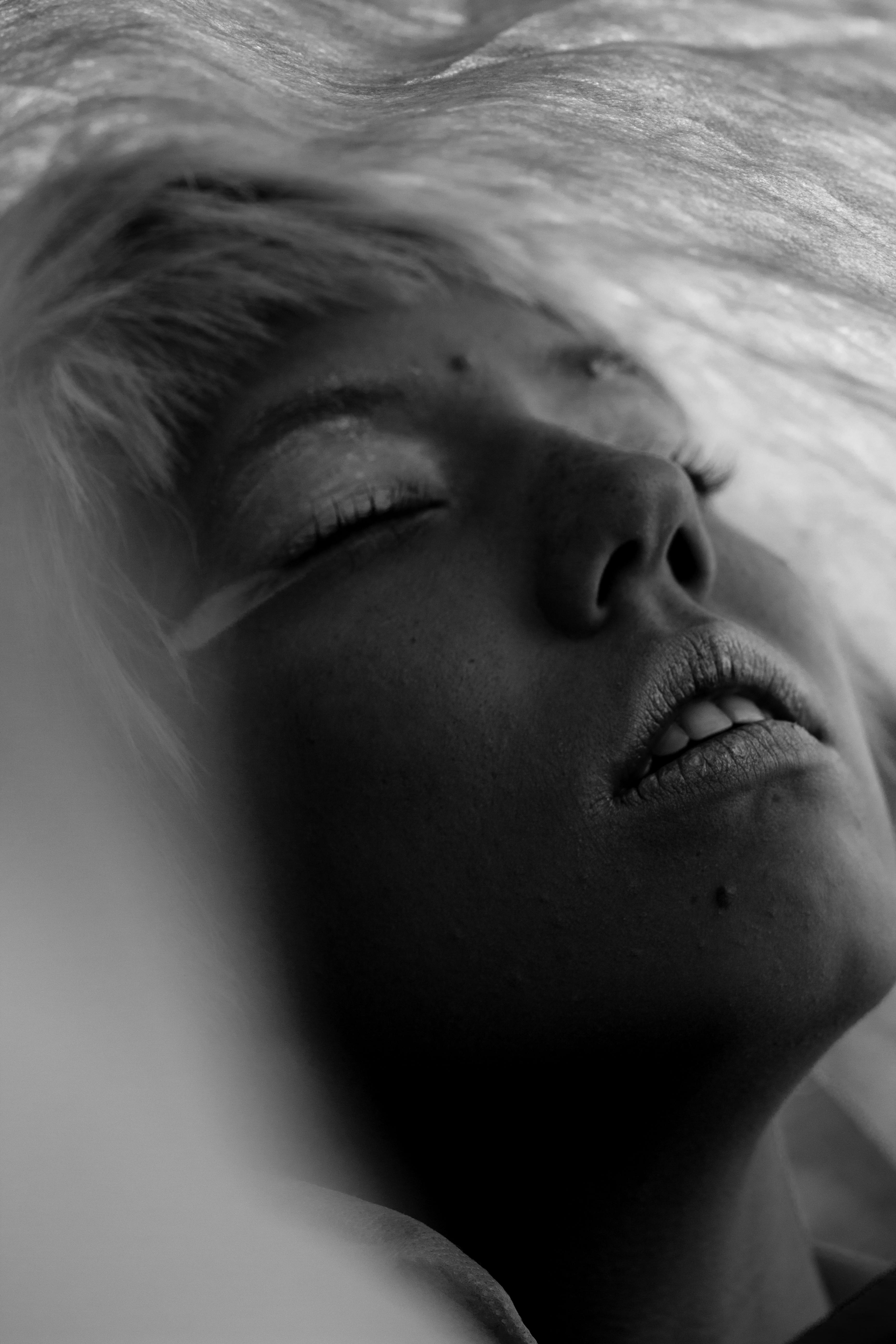 Close Up Shot of a Woman While Eyes Closed · Free Stock Photo