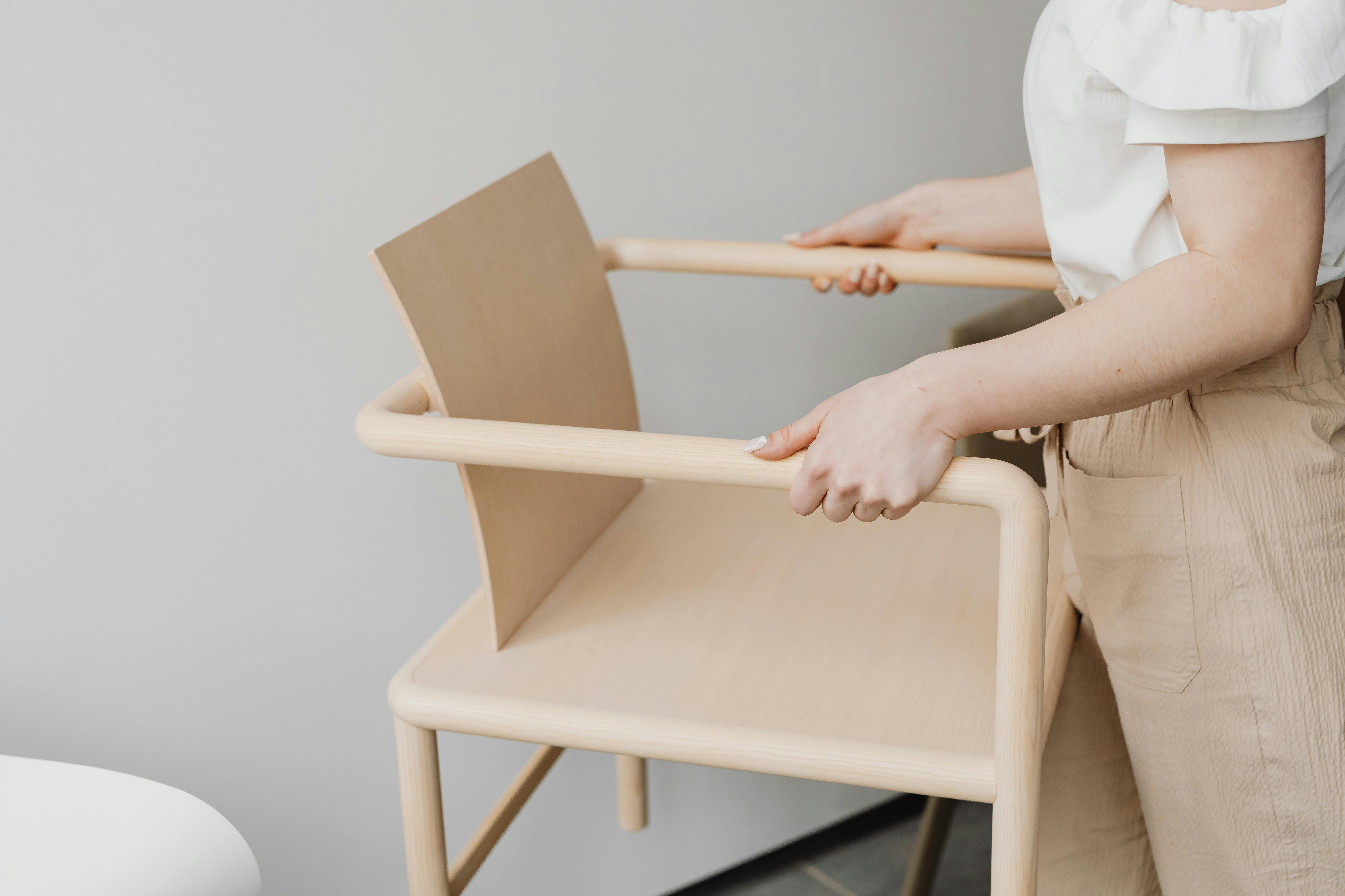 Female Hands Holding Chair · Free Stock Photo