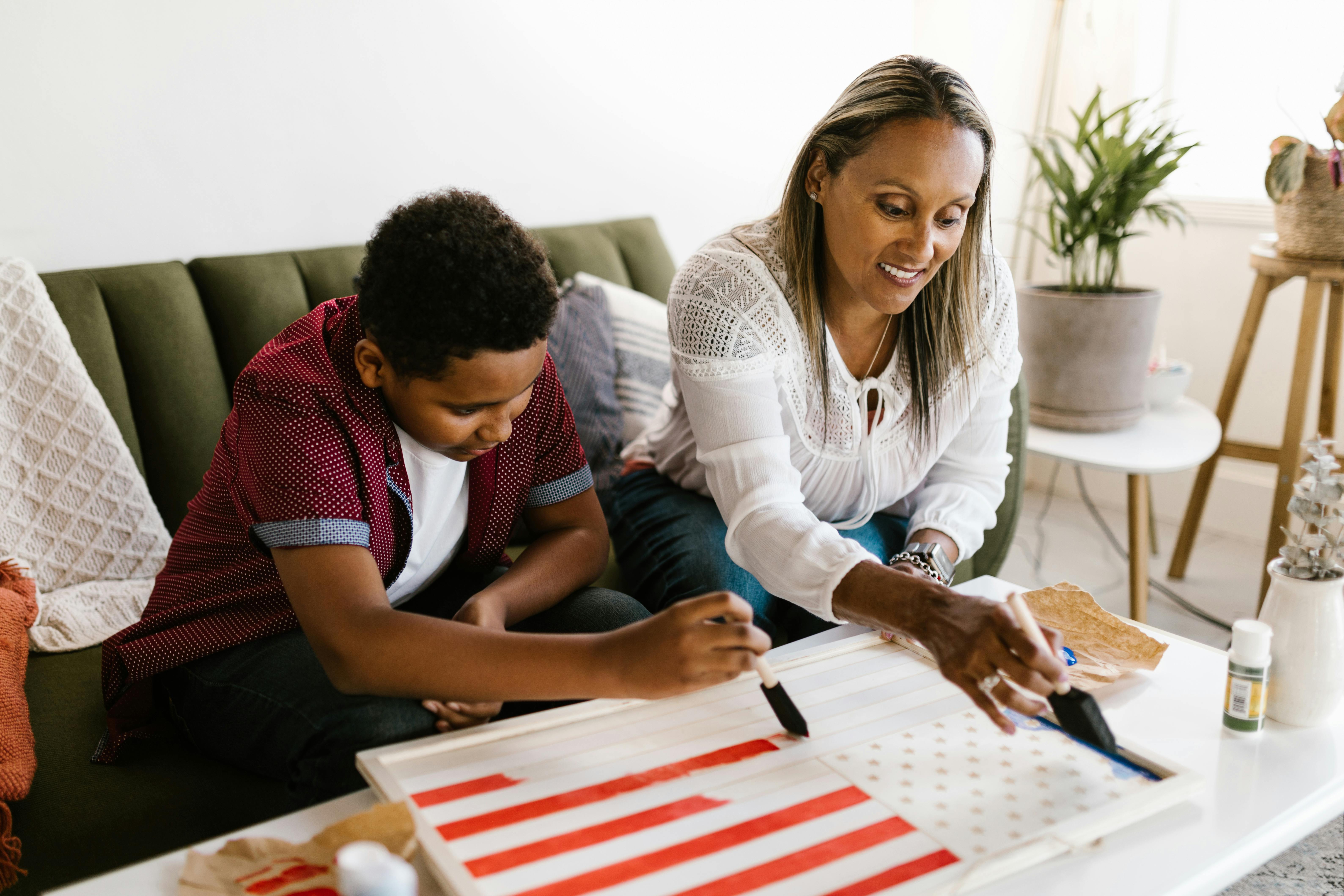 A Woman and Boy Doing School Project · Free Stock Photo