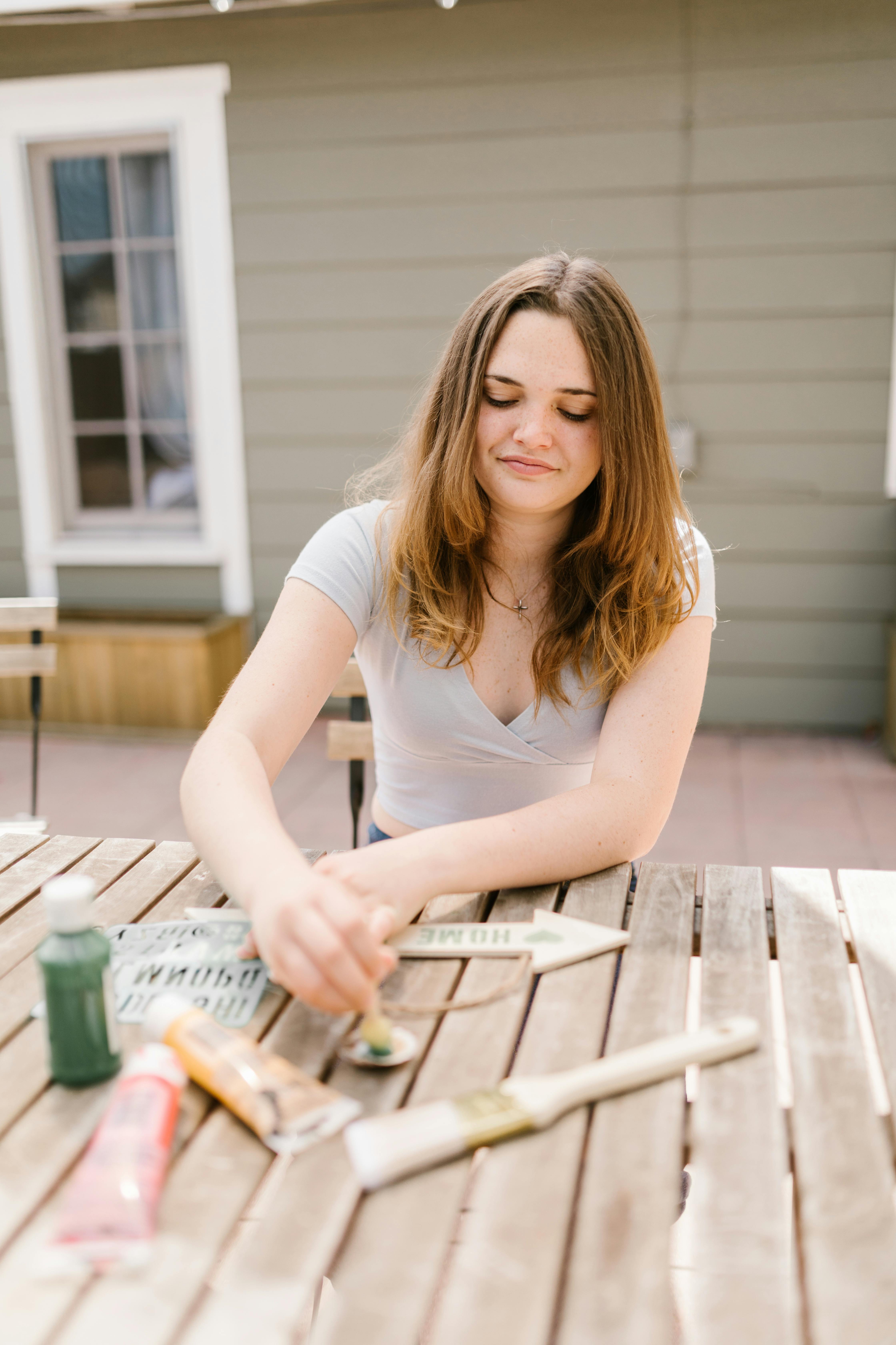 A Young Woman Doing Arts and Crafts · Free Stock Photo