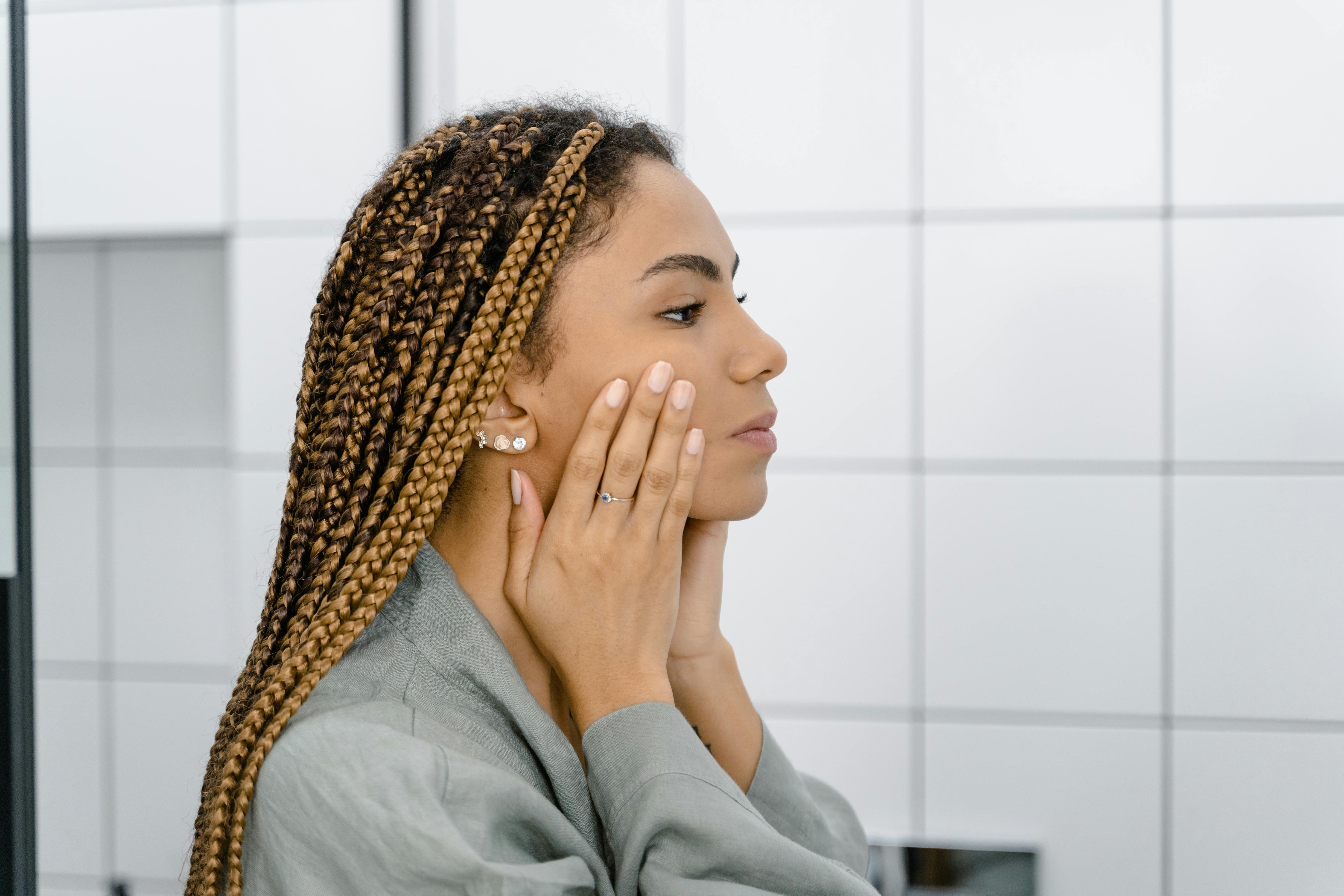 Woman Touching Her Face · Free Stock Photo