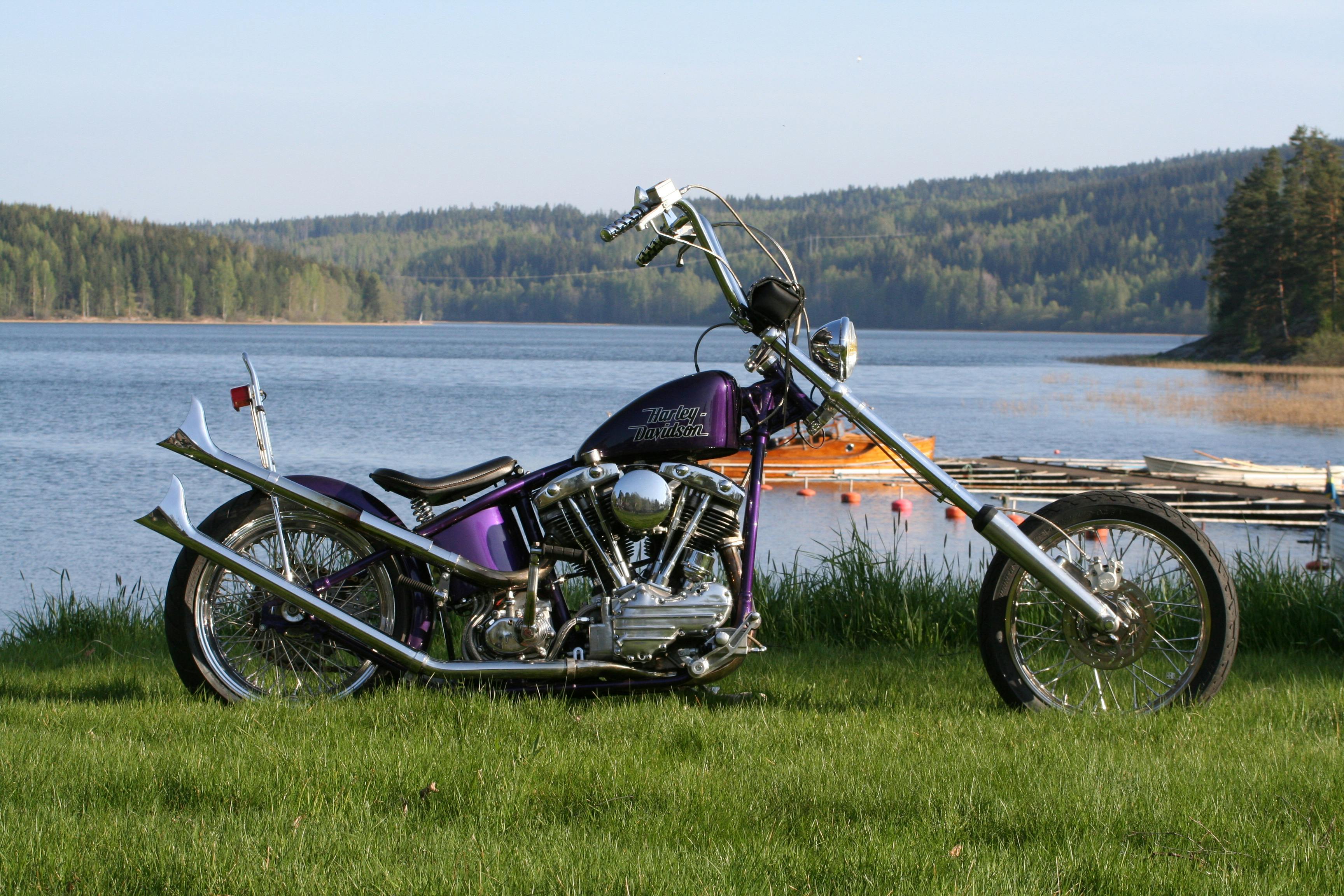 Cool Motorbike on Grass near Water · Free Stock Photo