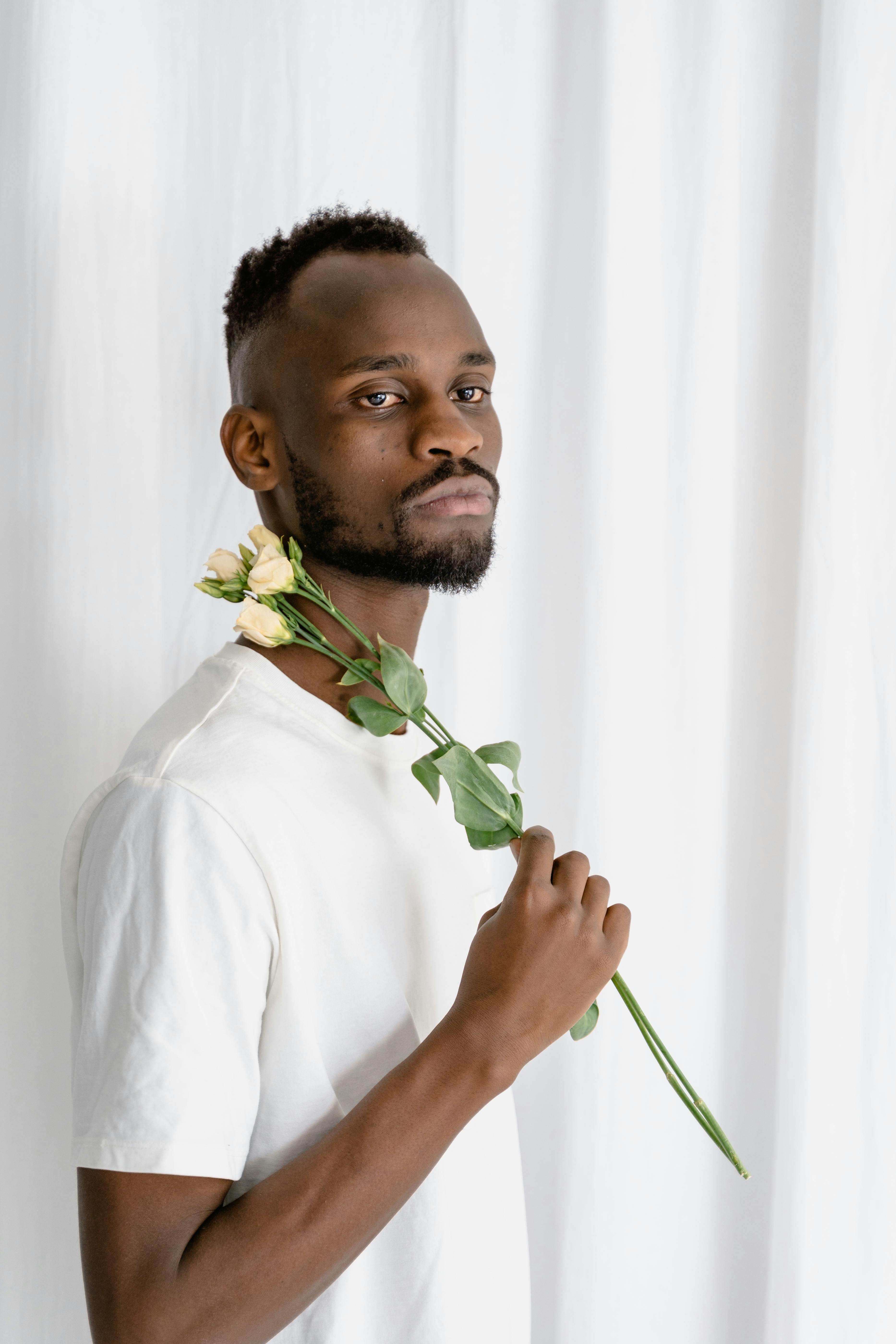 Man Holding White Roses · Free Stock Photo