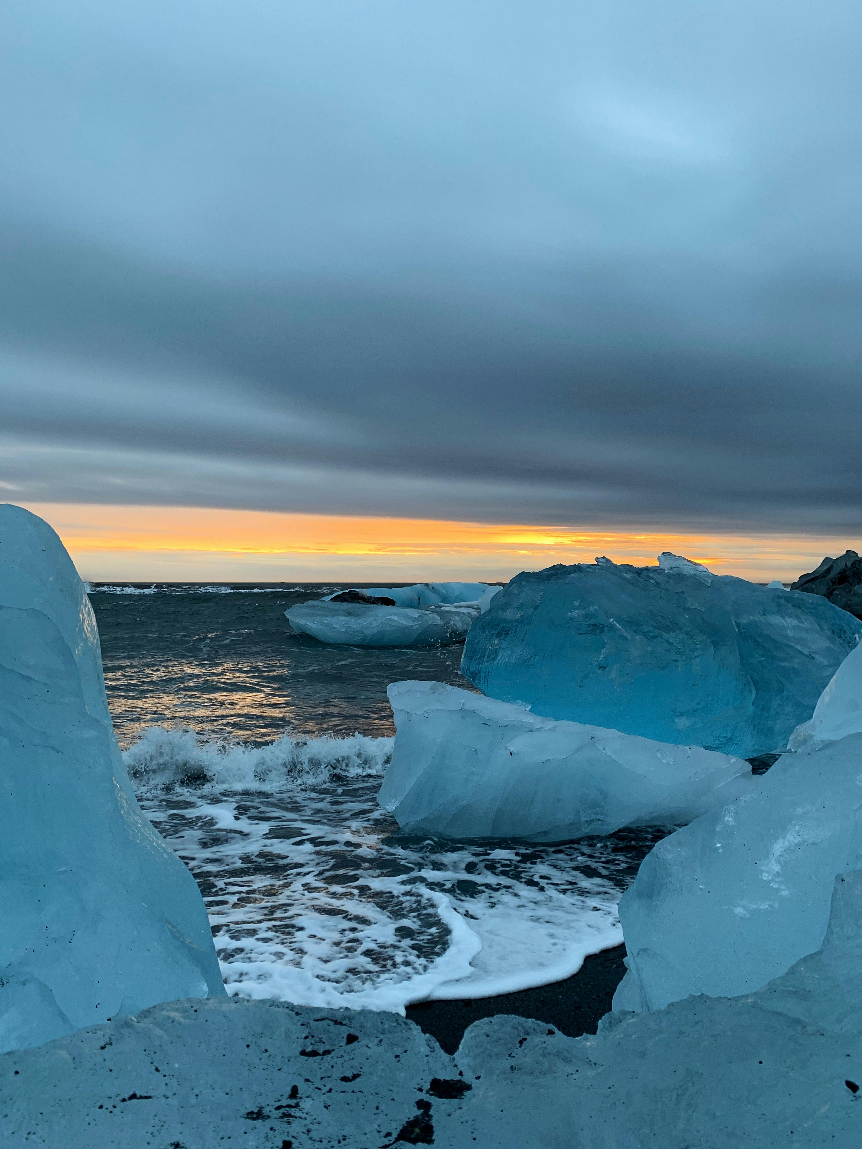 Ice Burg Floating on Water during Daytime · Free Stock Photo