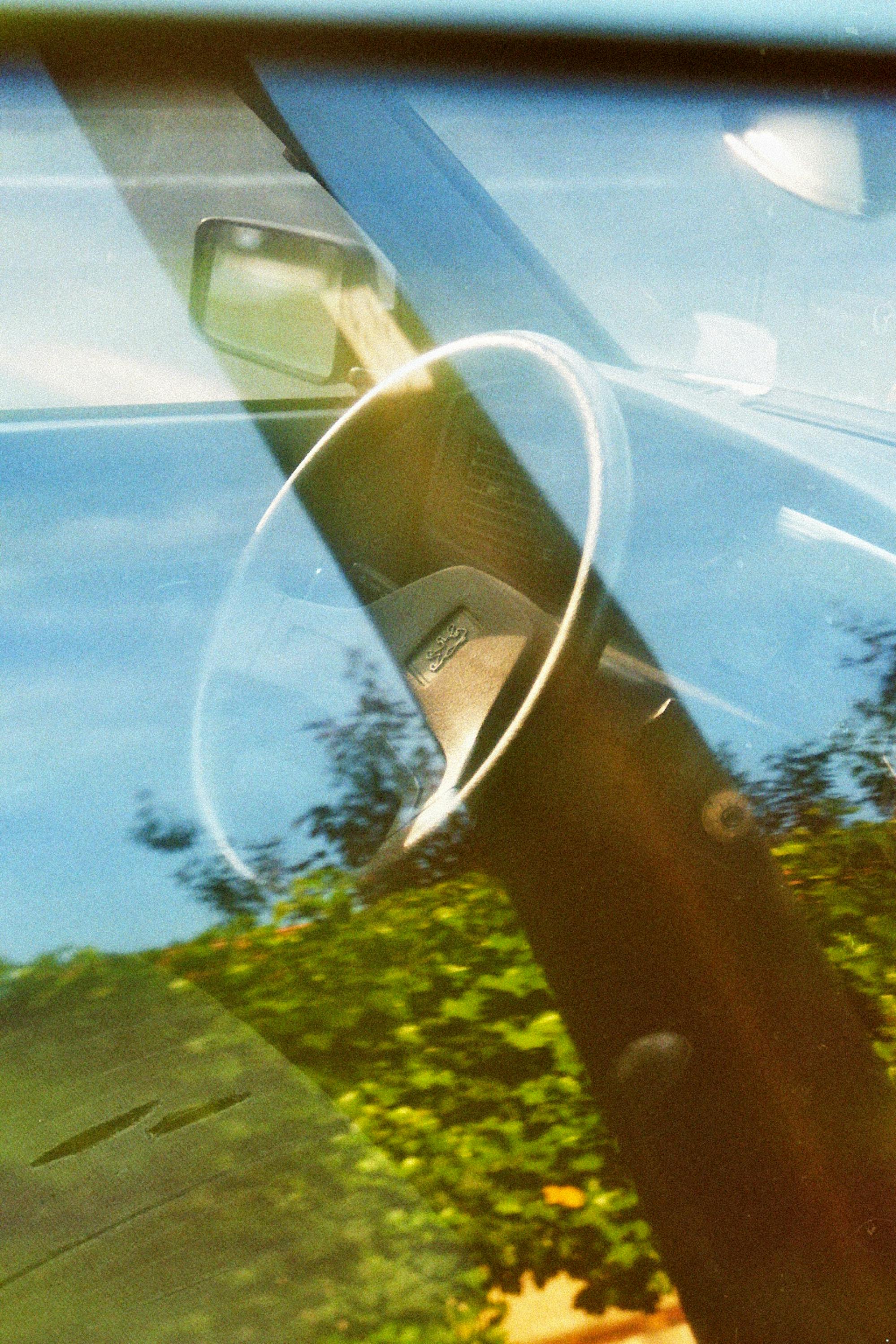 Car Interior Seen through Reflection in Window · Free Stock Photo