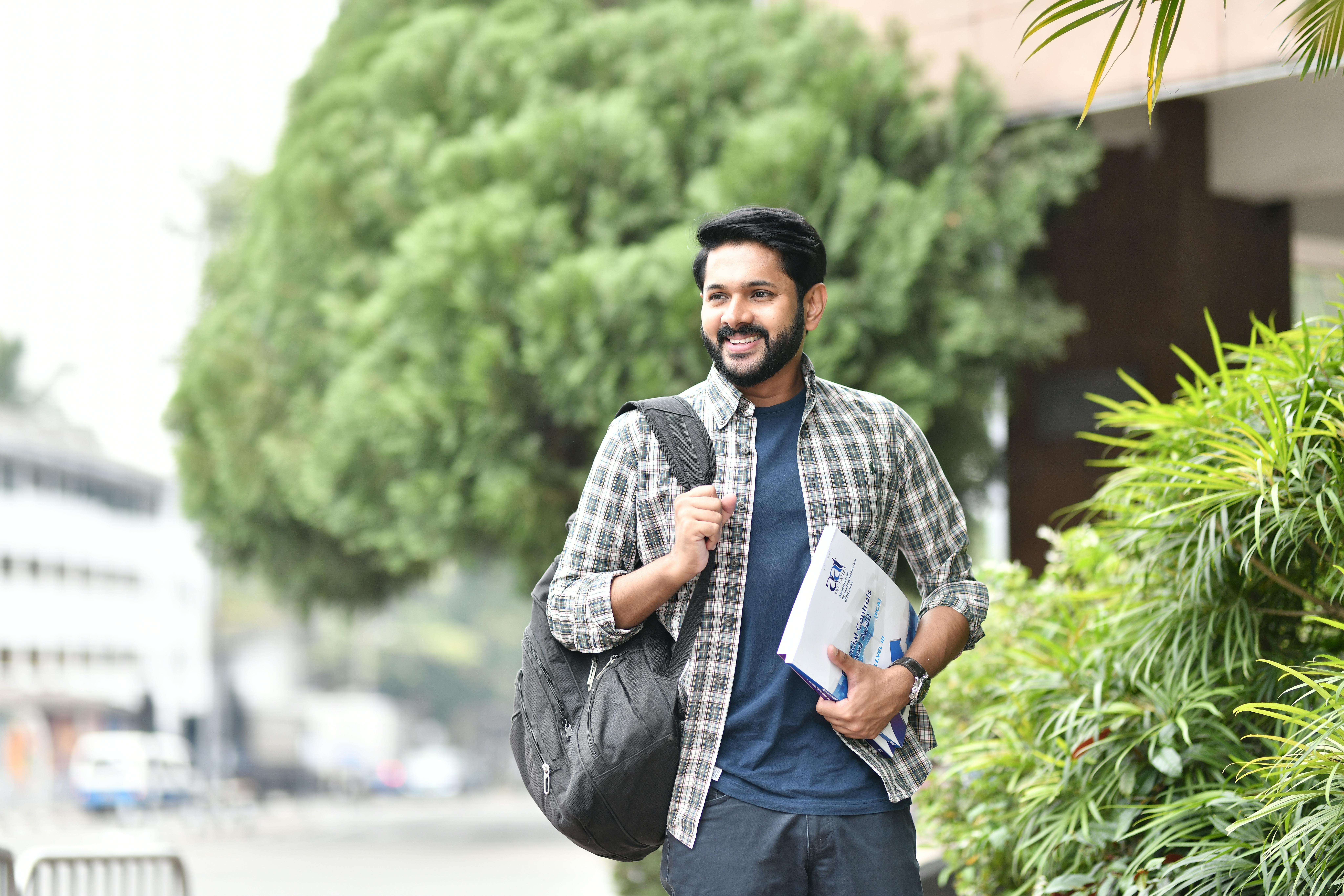 A Man with Backpack Smiling · Free Stock Photo
