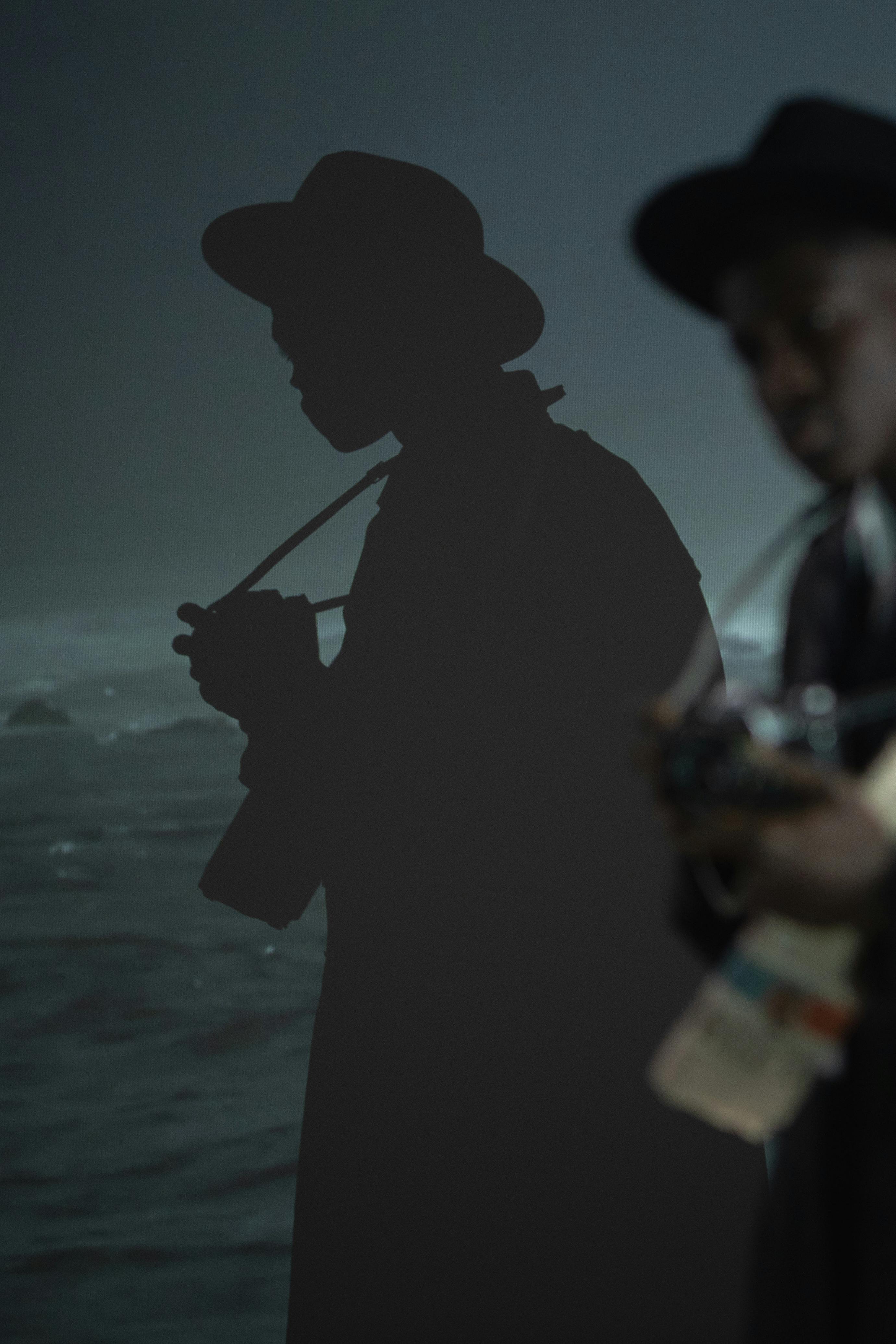 A Shadow of a Man Holding a Camera · Free Stock Photo