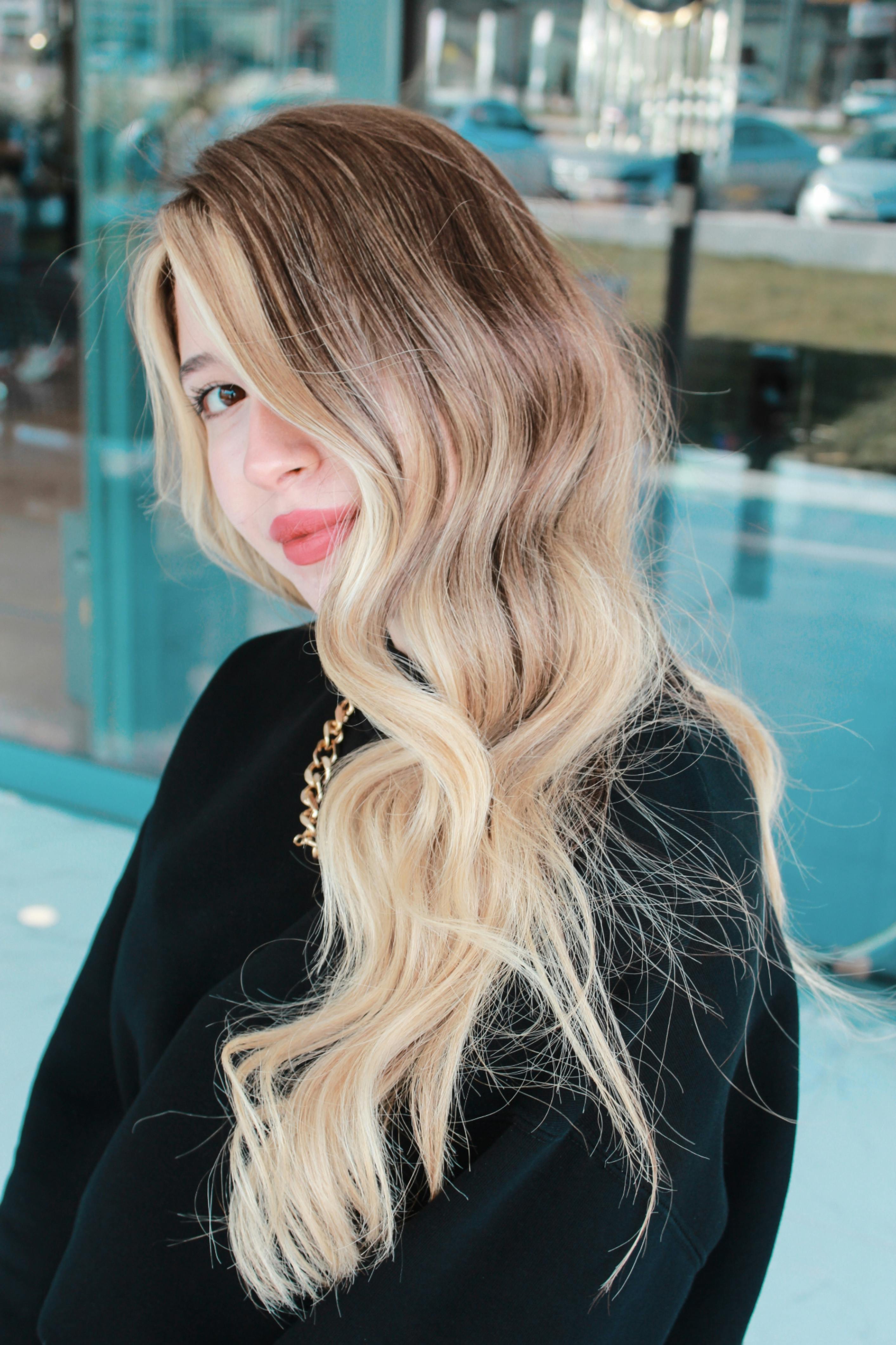 Blonde Girl Tousling Hair · Free Stock Photo