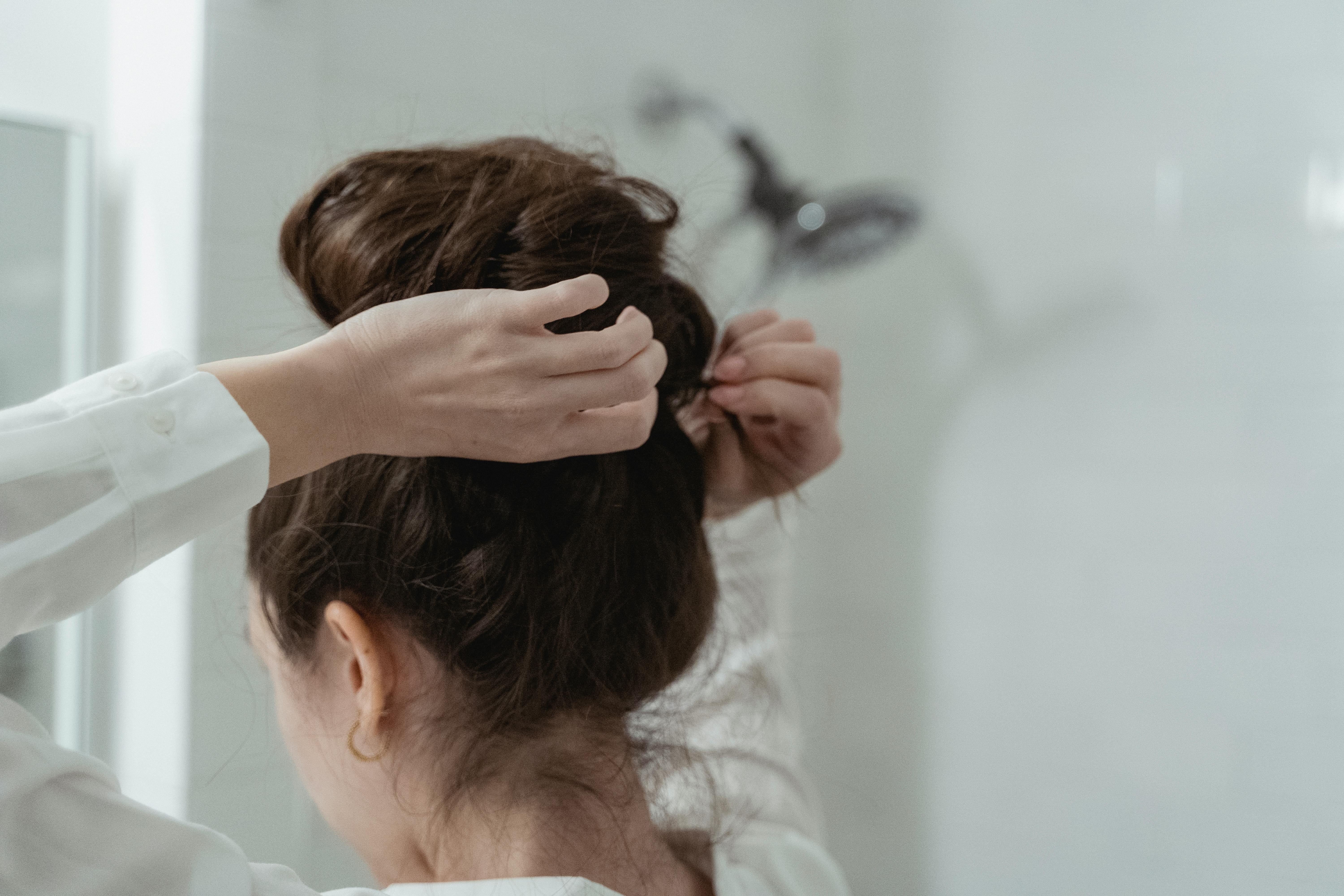 Close-up of Woman Making Hairstyle · Free Stock Photo