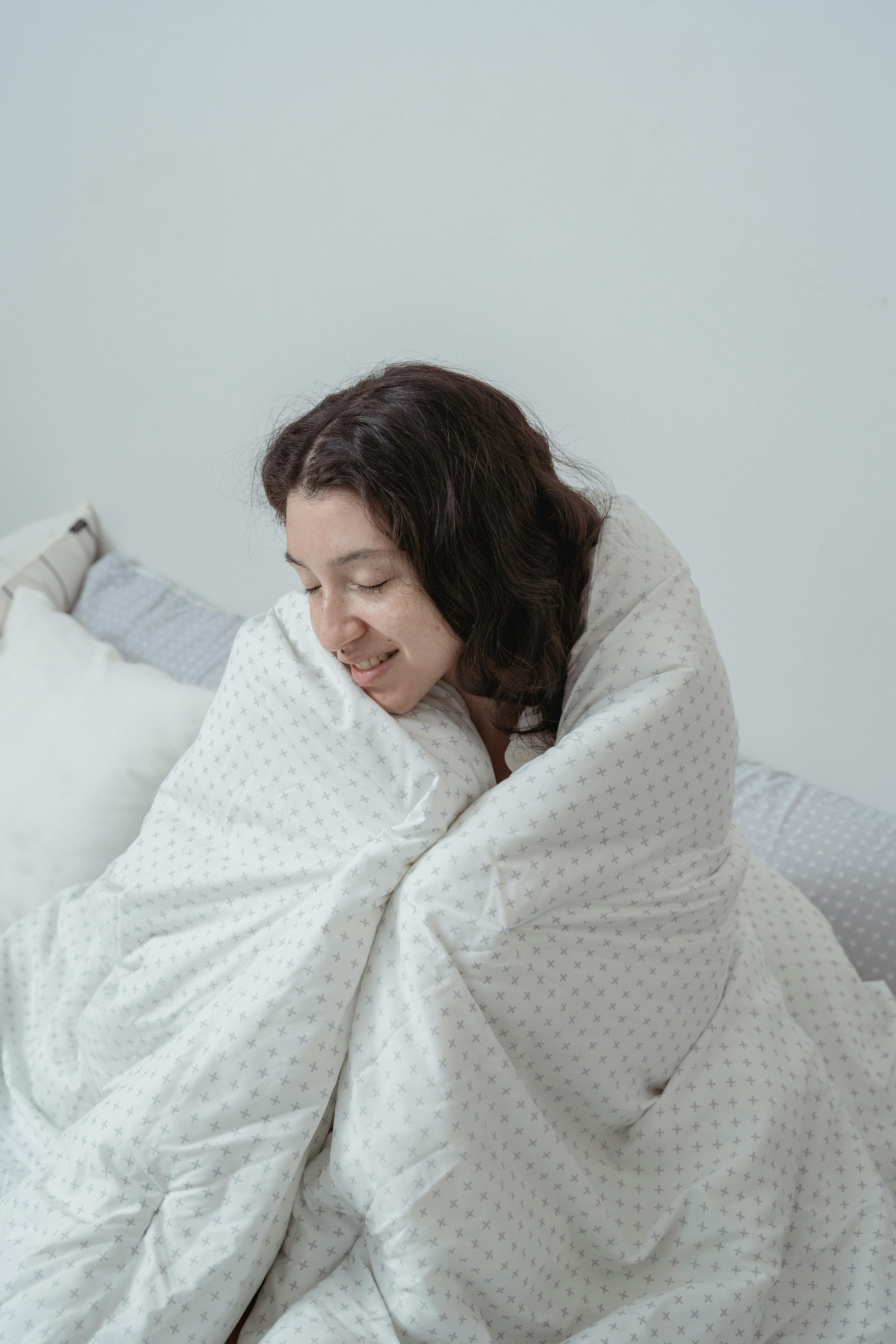 Woman Wrapped in a Comforter · Free Stock Photo