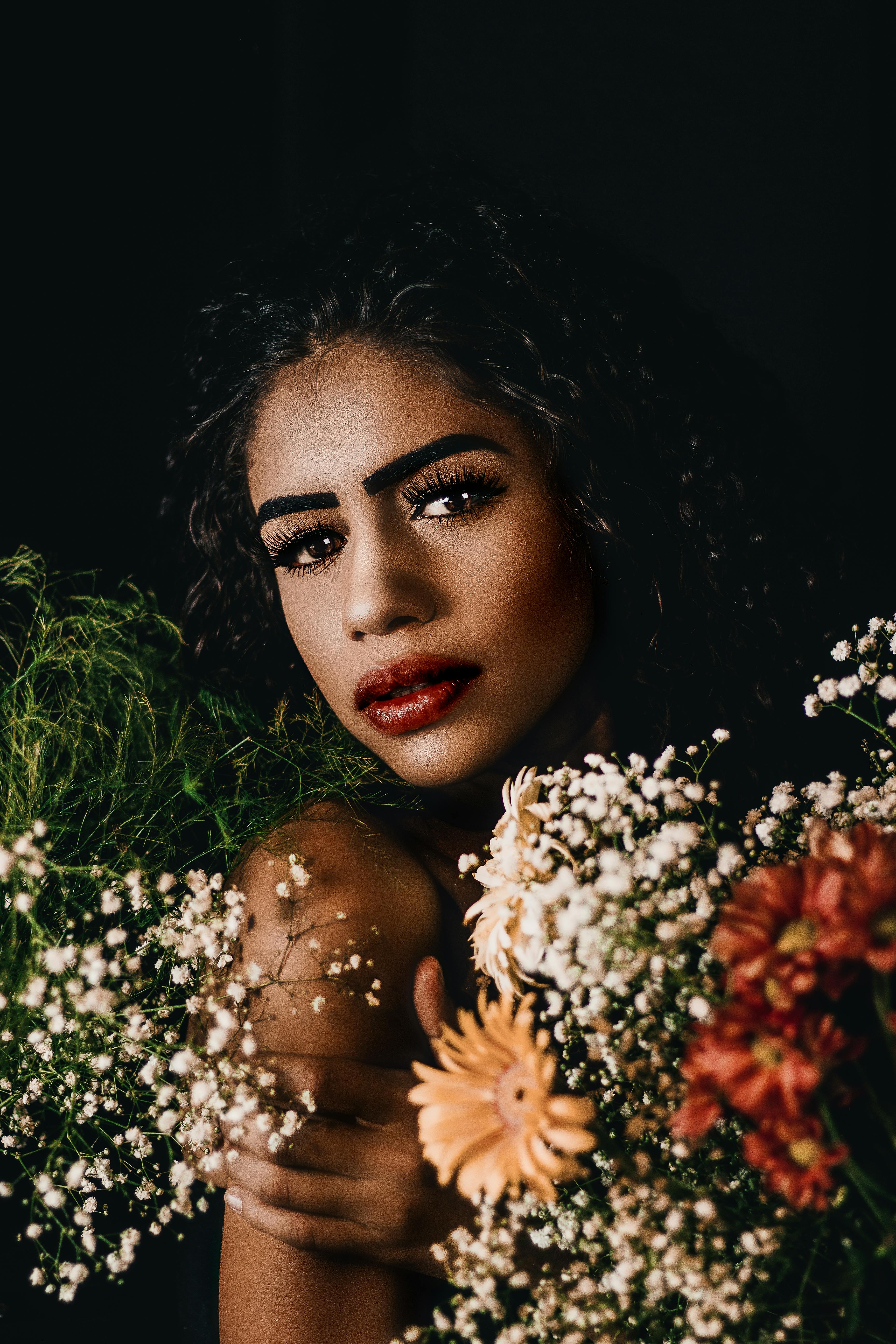 Woman Surrounded with Flowers · Free Stock Photo