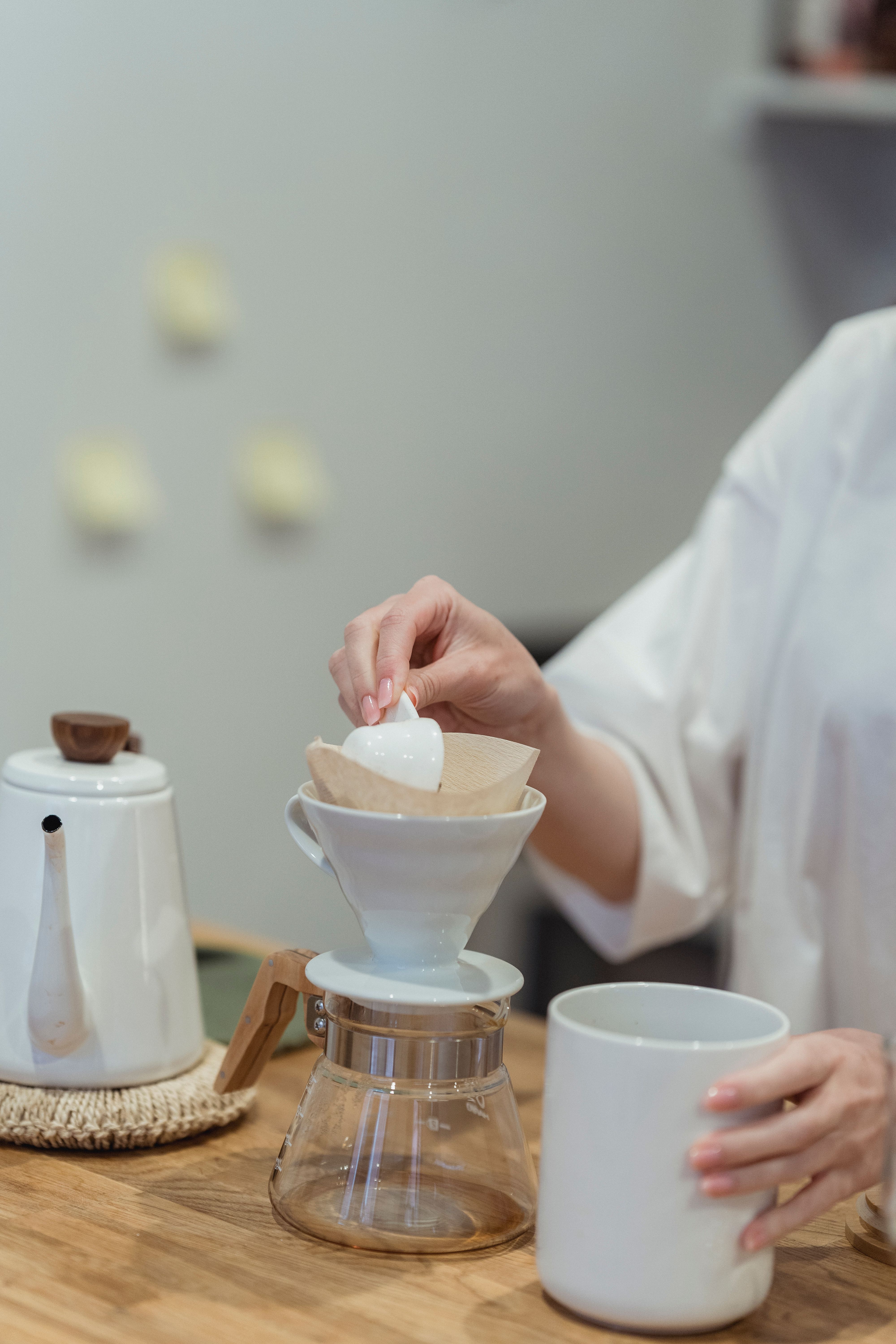 Person Putting Coffee Powder On Filter · Free Stock Photo