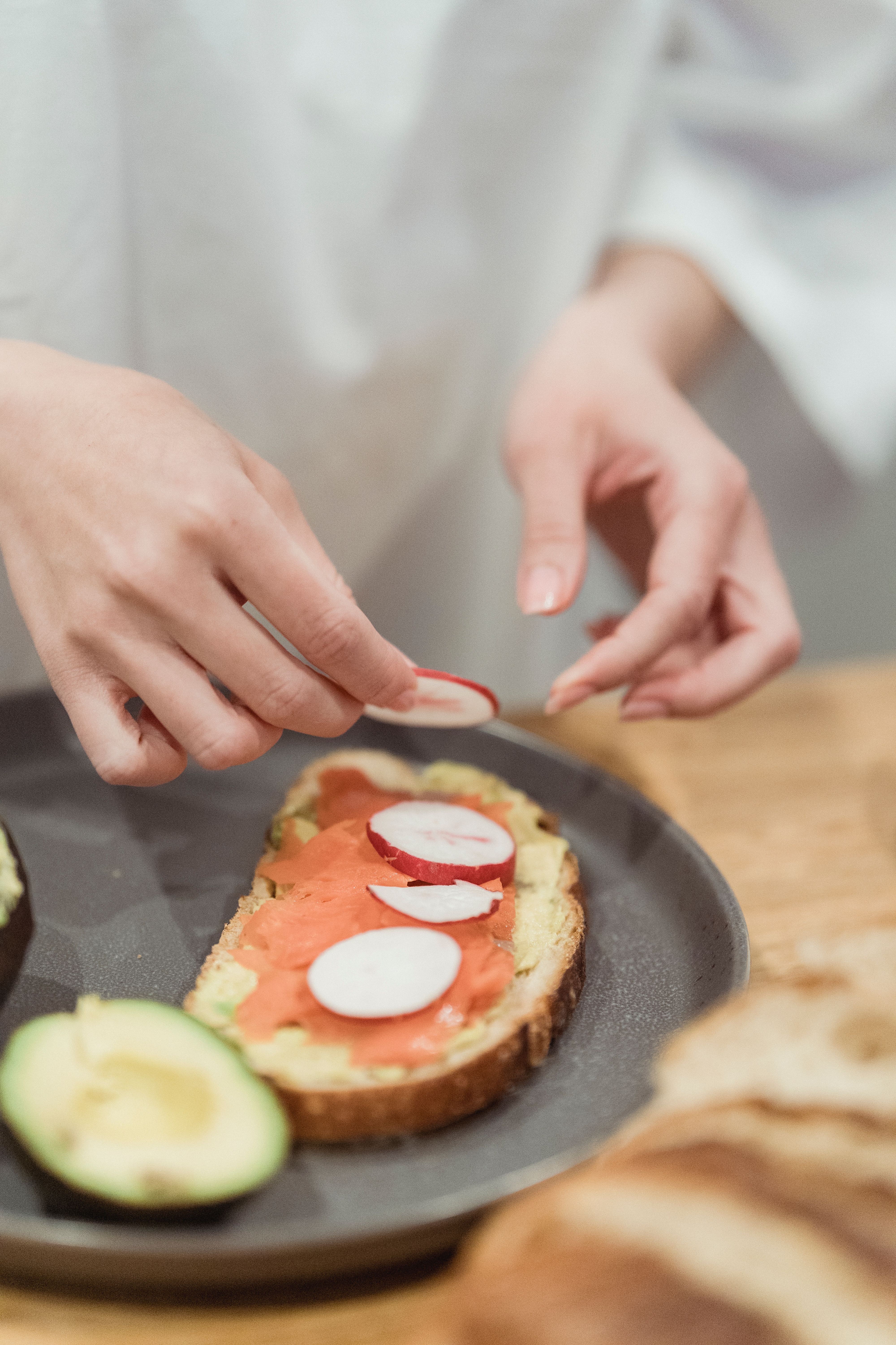 CLose-Up Shot of a Person Making a Sandwich · Free Stock Photo