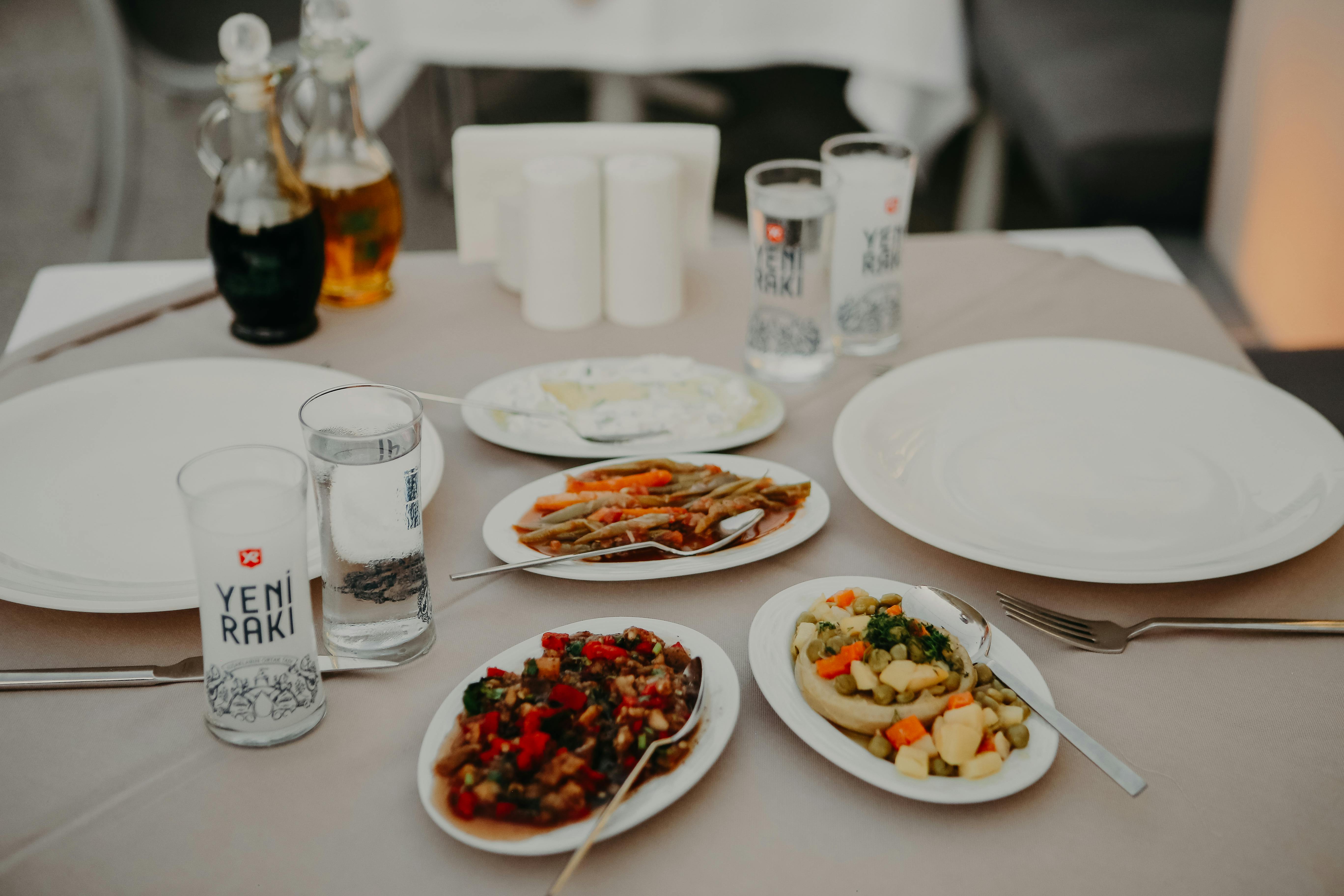 Plates with leftover food on table · Free Stock Photo