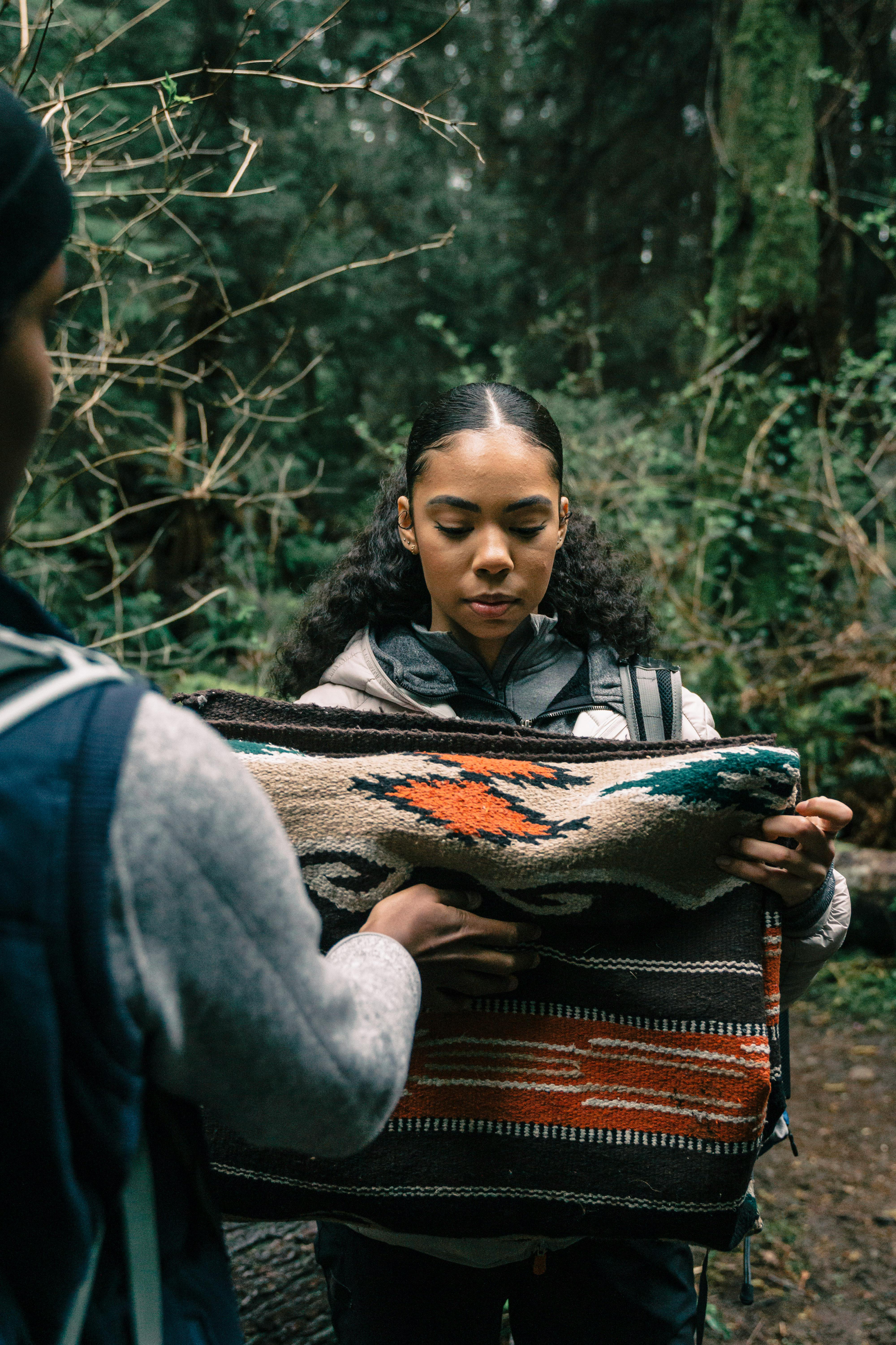 Two Women Holding a Rug · Free Stock Photo