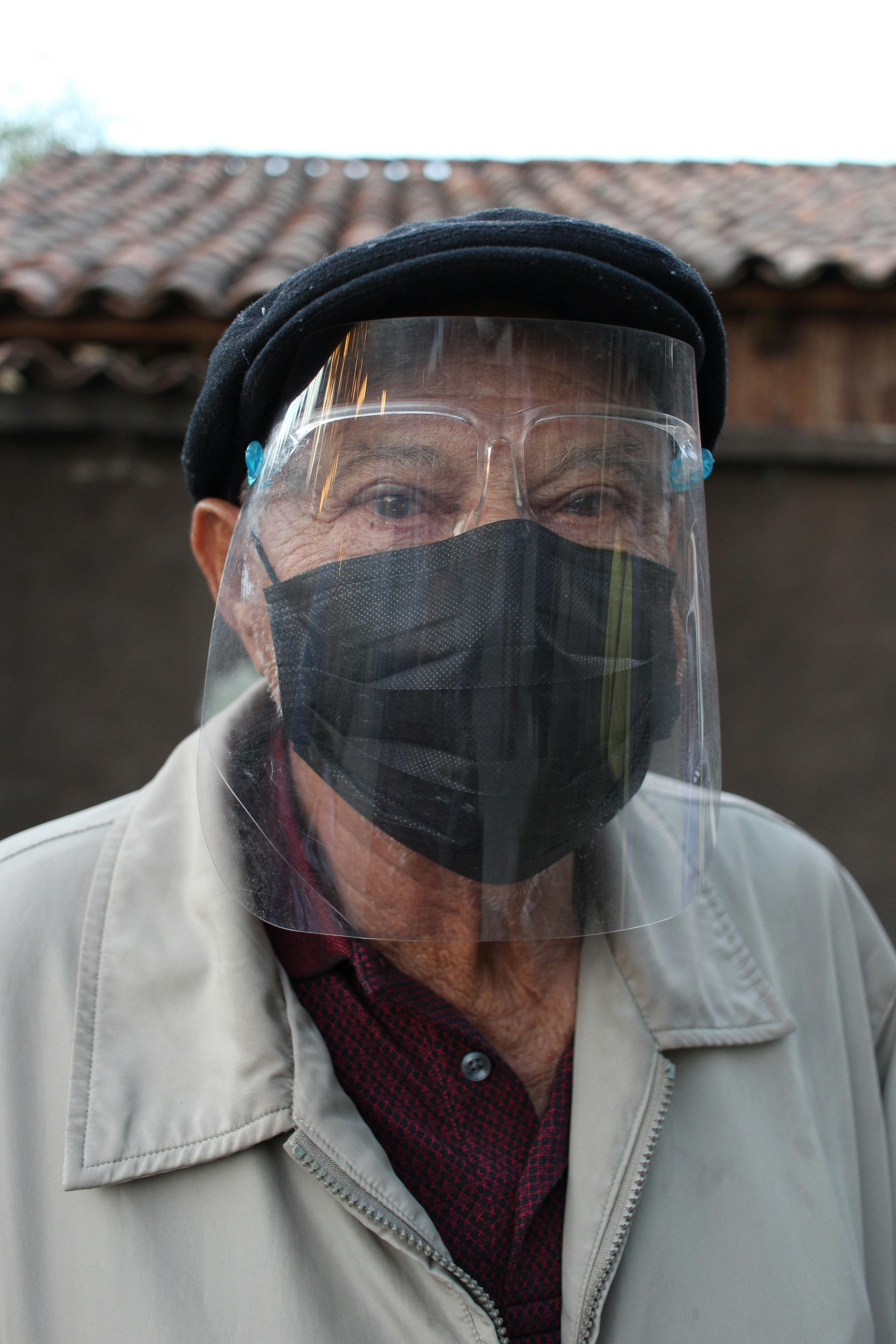A Man Wear a Face Mask and a Face Shield · Free Stock Photo
