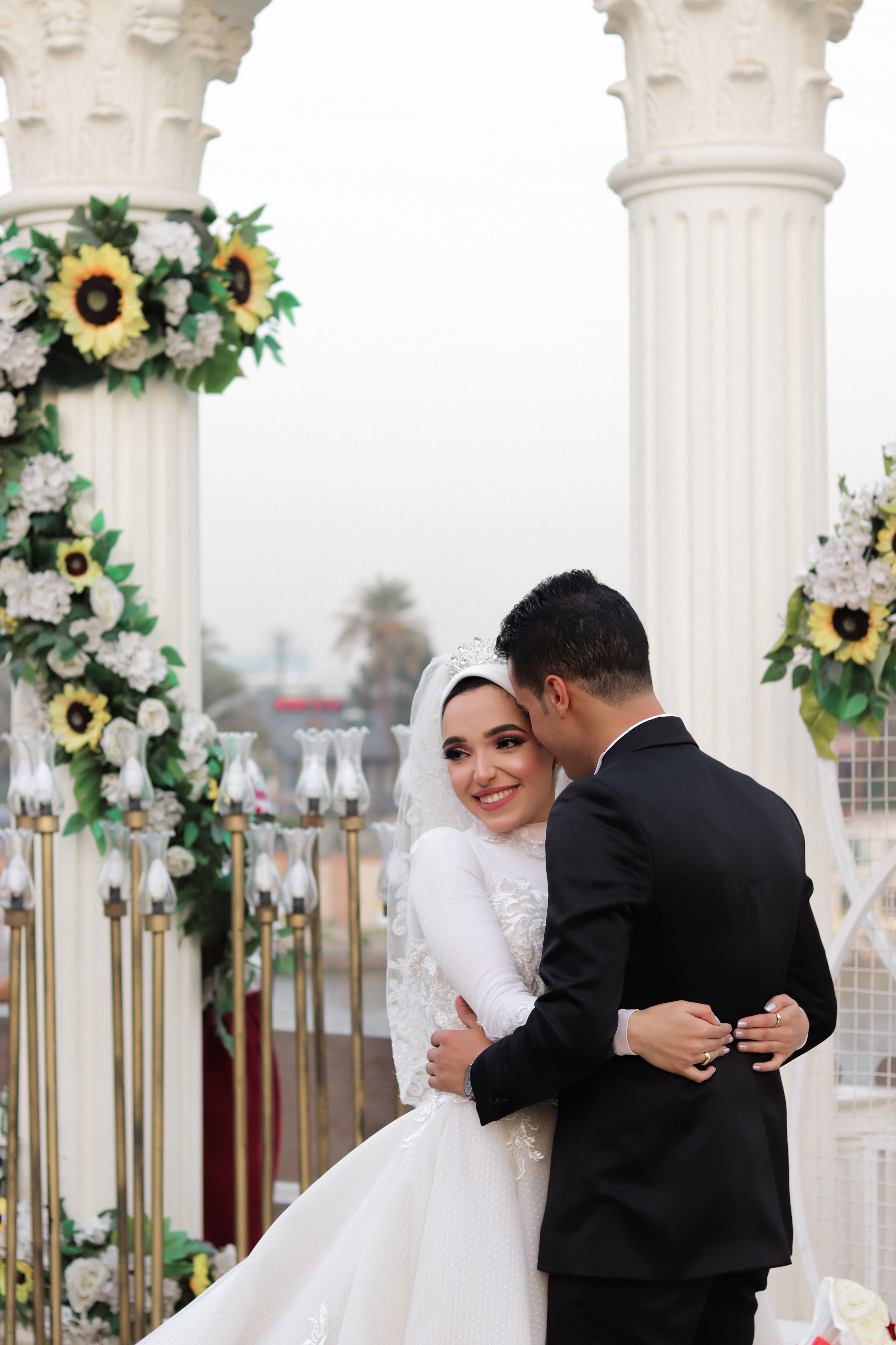 Photo of a Standing Wedding Couple Wearing Traditional Wedding Dress ...